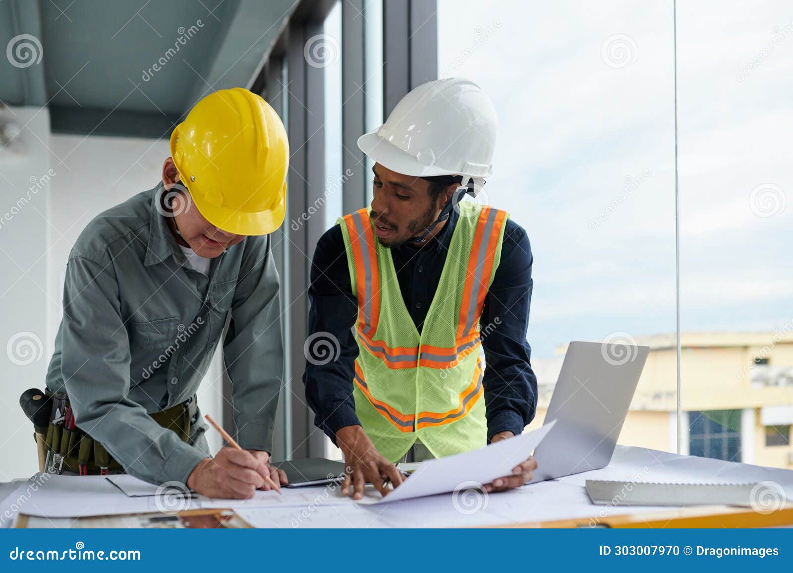 Construction Workers Checking Building Blueprints Stock Photo - Image of check, civil: 303007970