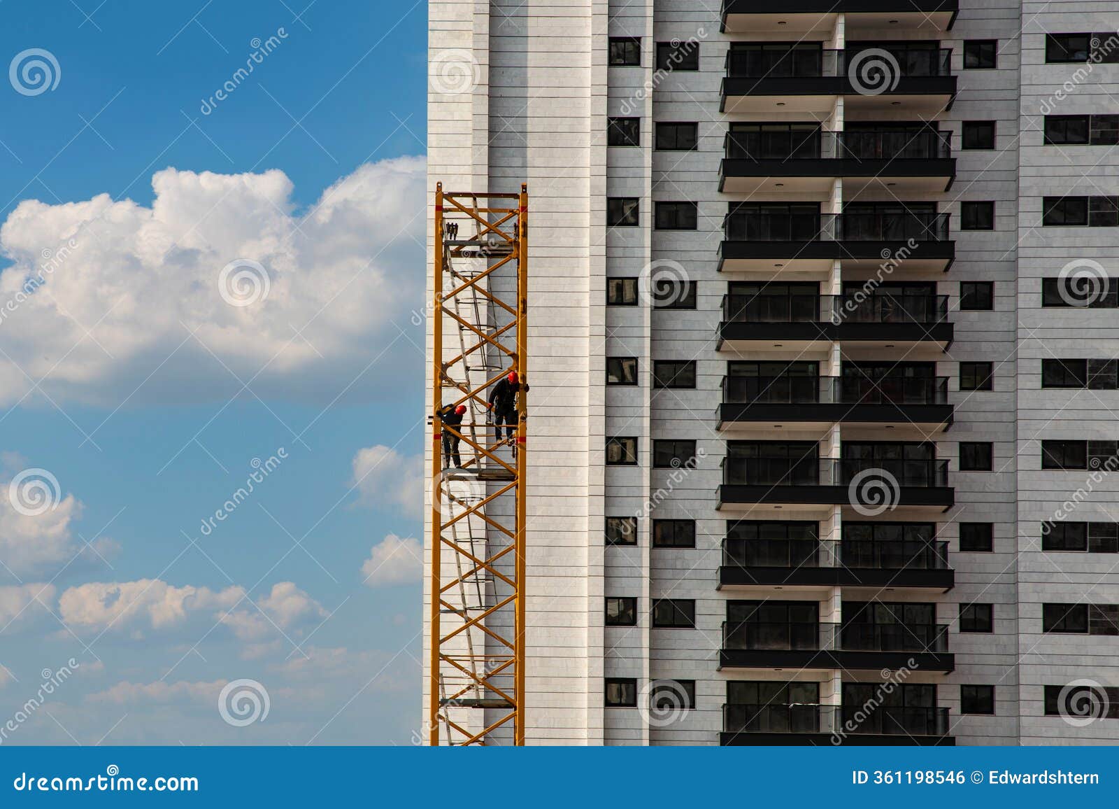 Construction Workers are Climbing a Scaffolding Structure beside a Tall ...