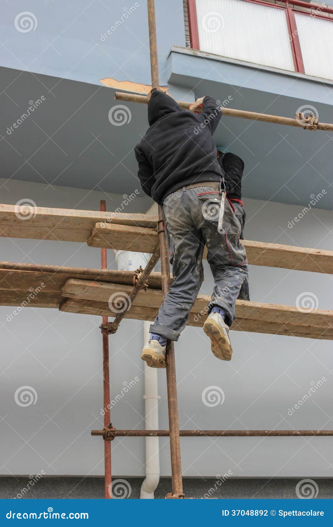 Construction Workers Climbs on Scaffolding Stock Photo - Image of ...