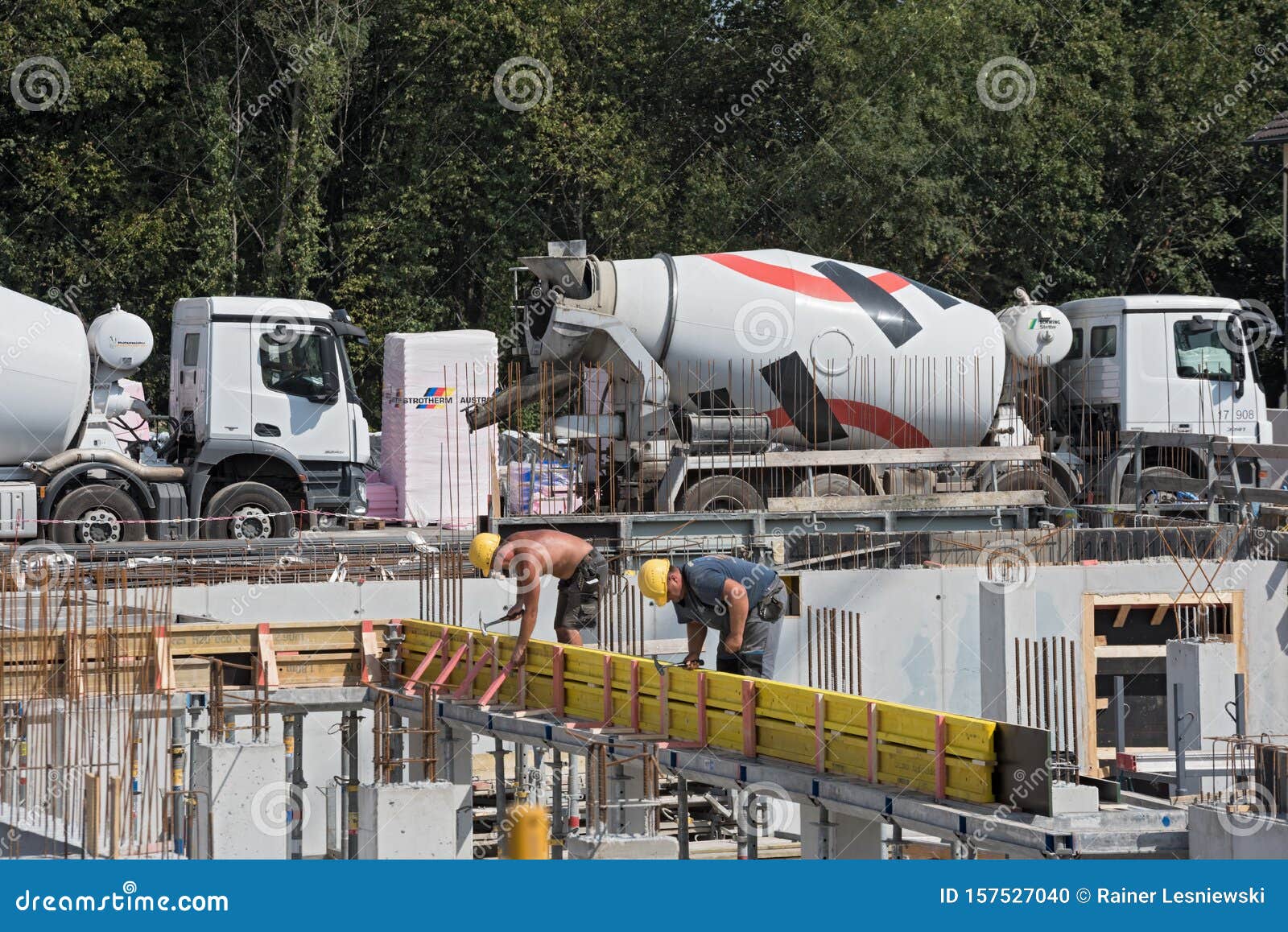 Construction Workers Collaborating in the Installation of Cement ...