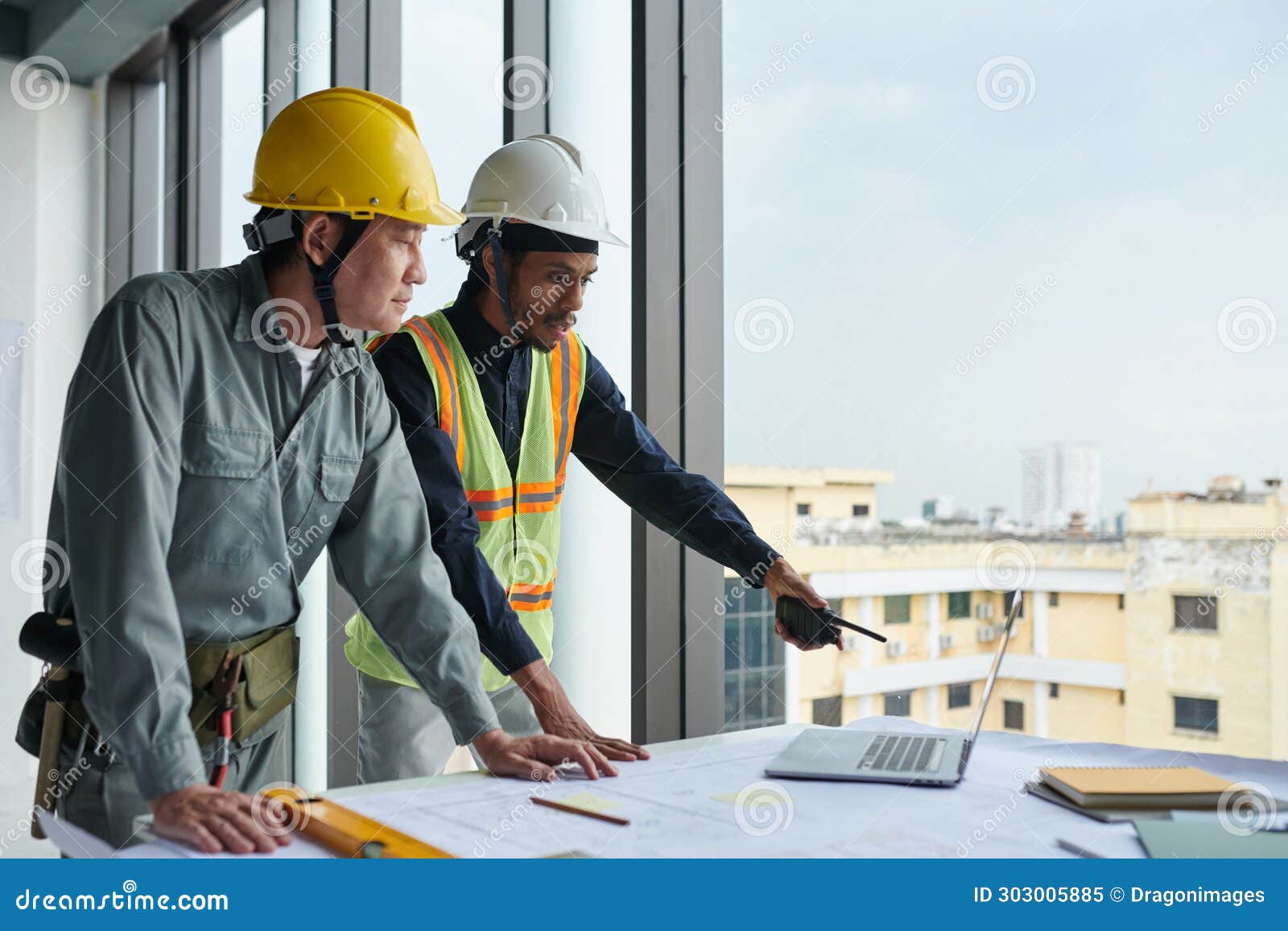 Construction Workers Discussing Plan Stock Image - Image of building ...