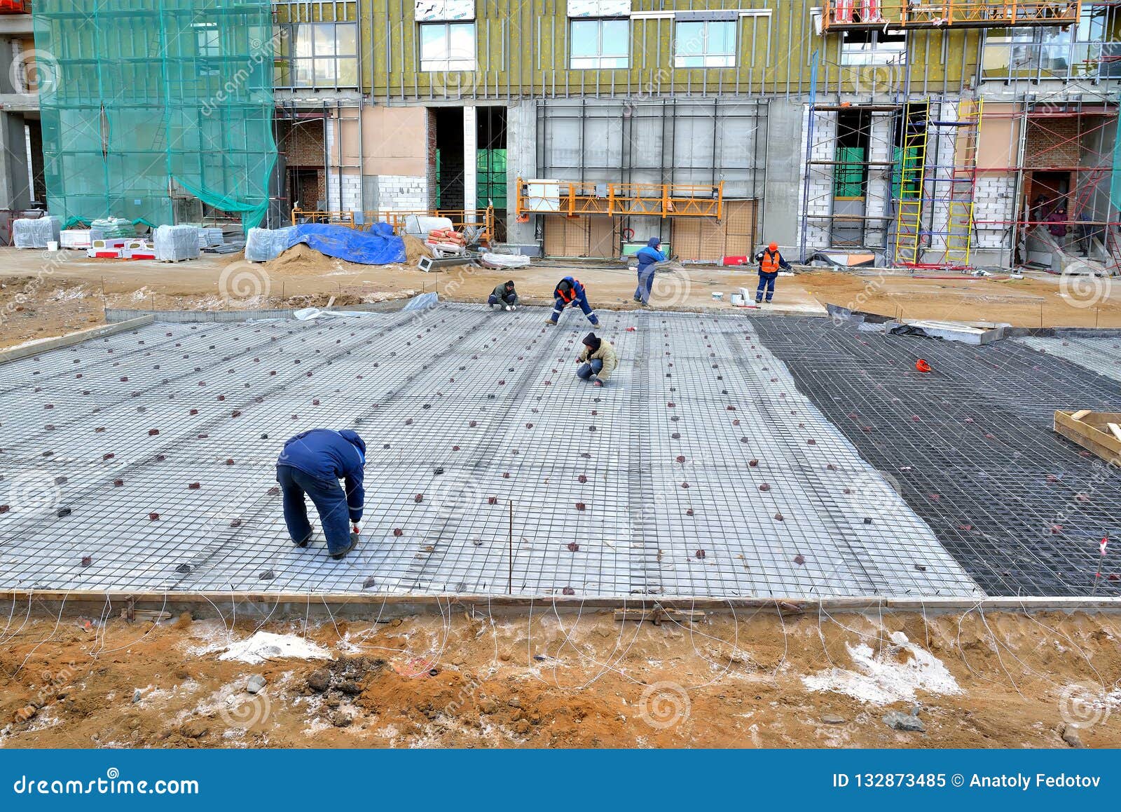 Construction Workers Doind on a Iron Reinforcement and Concrete ...