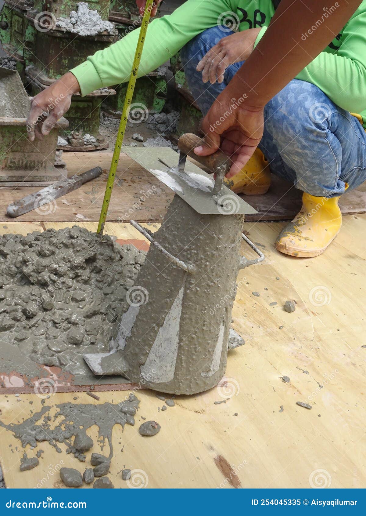 Construction Workers Doing Slump Test Using Appropriate Equipment at ...