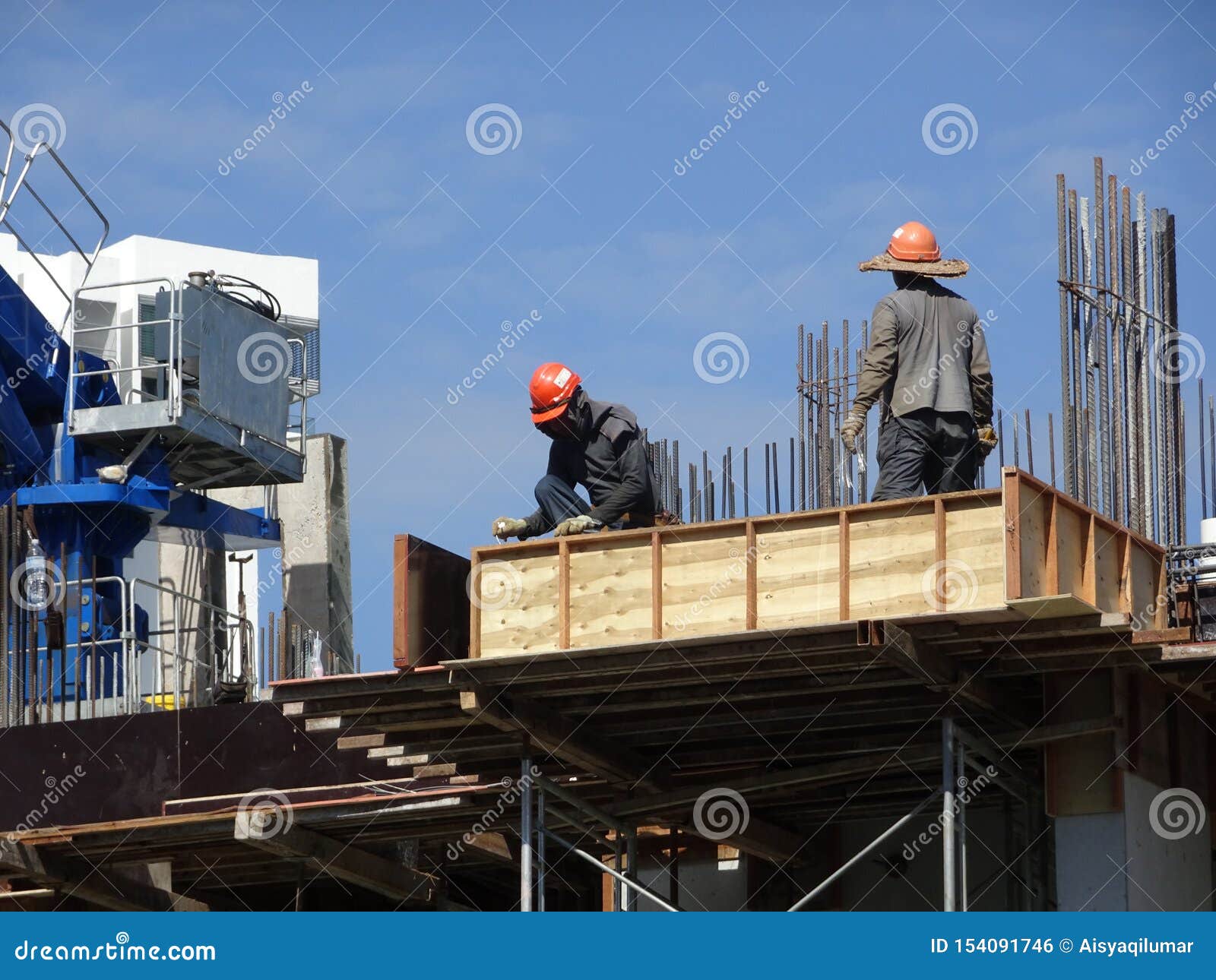 Construction Workers Fabricated Timber Form Work at the Construction ...