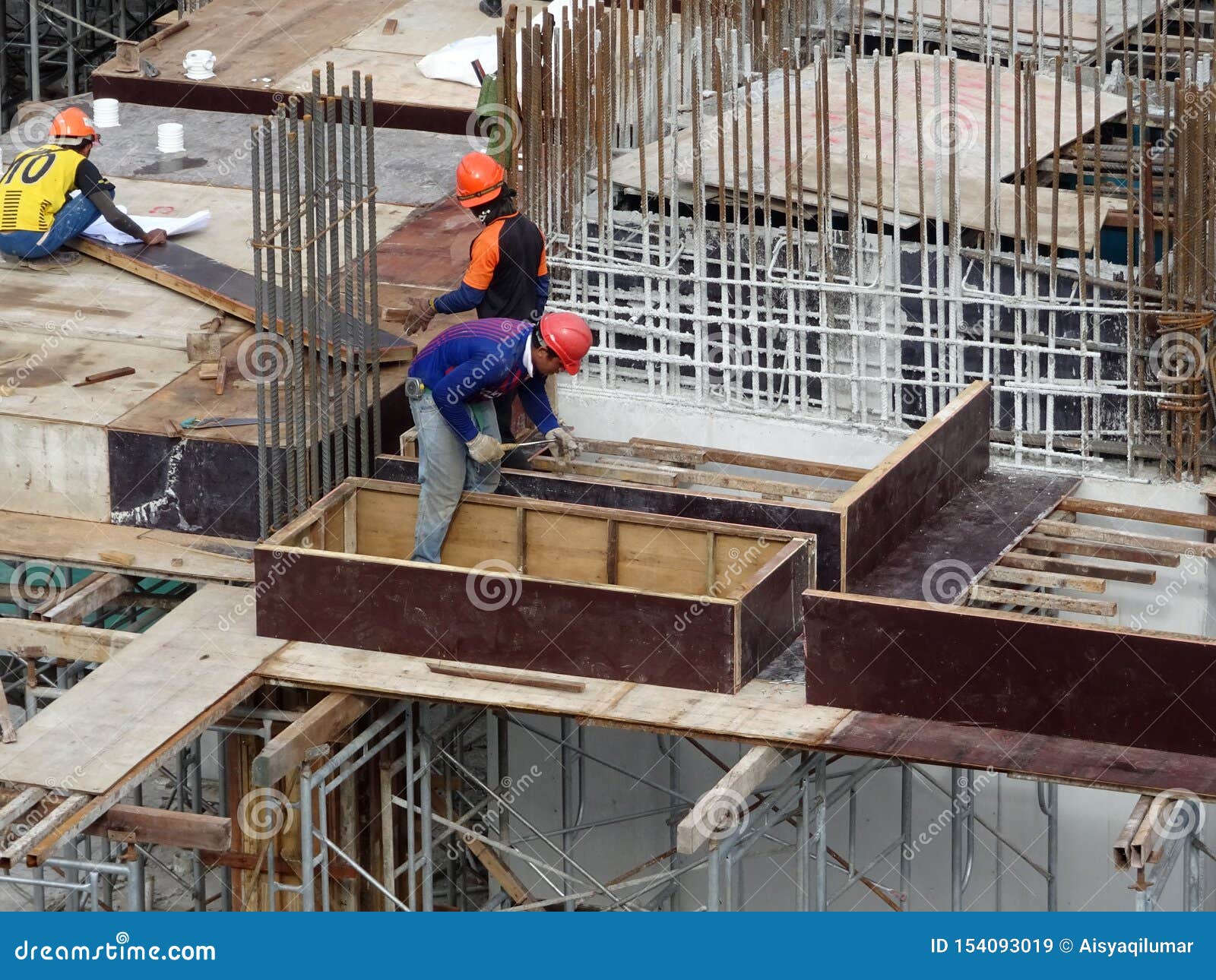 Construction Workers Fabricated Timber Form Work at the Construction ...
