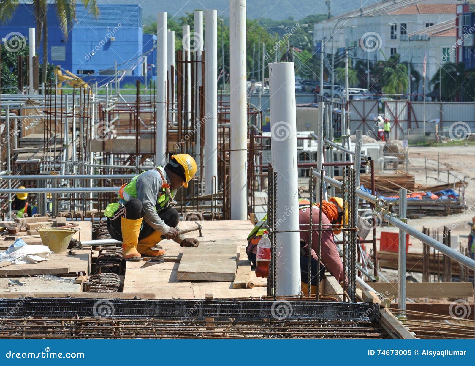 Construction Workers Fabricating Timber Form Work at the Construction ...