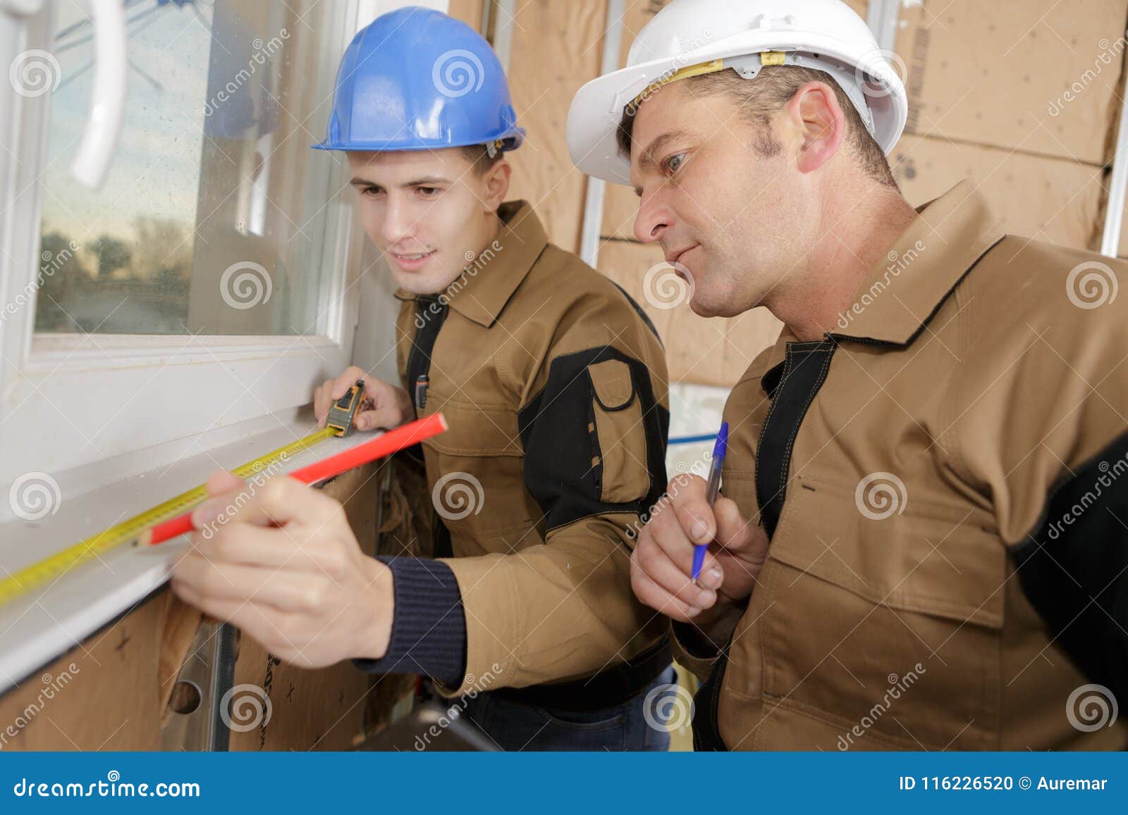 Construction Workers Fitting Windows Stock Photo - Image of worker ...