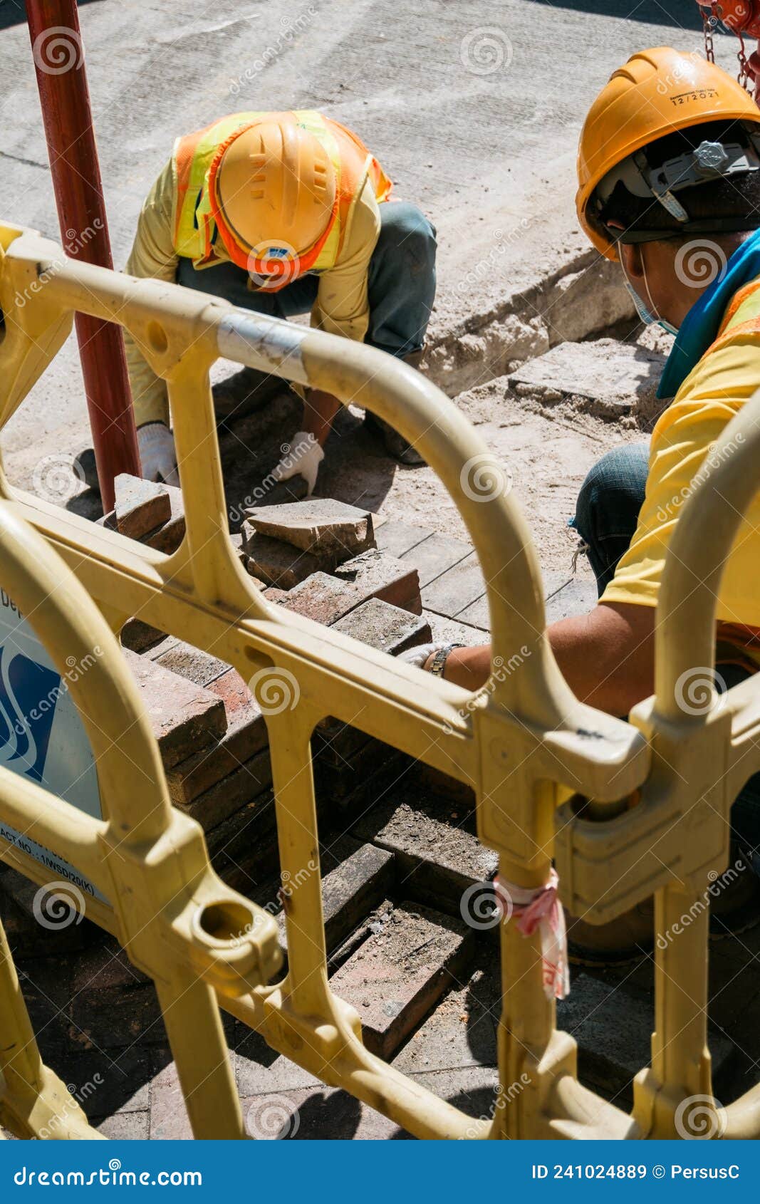 Construction Workers with Hard Hats on Behind Plastic Fence Stock Image ...