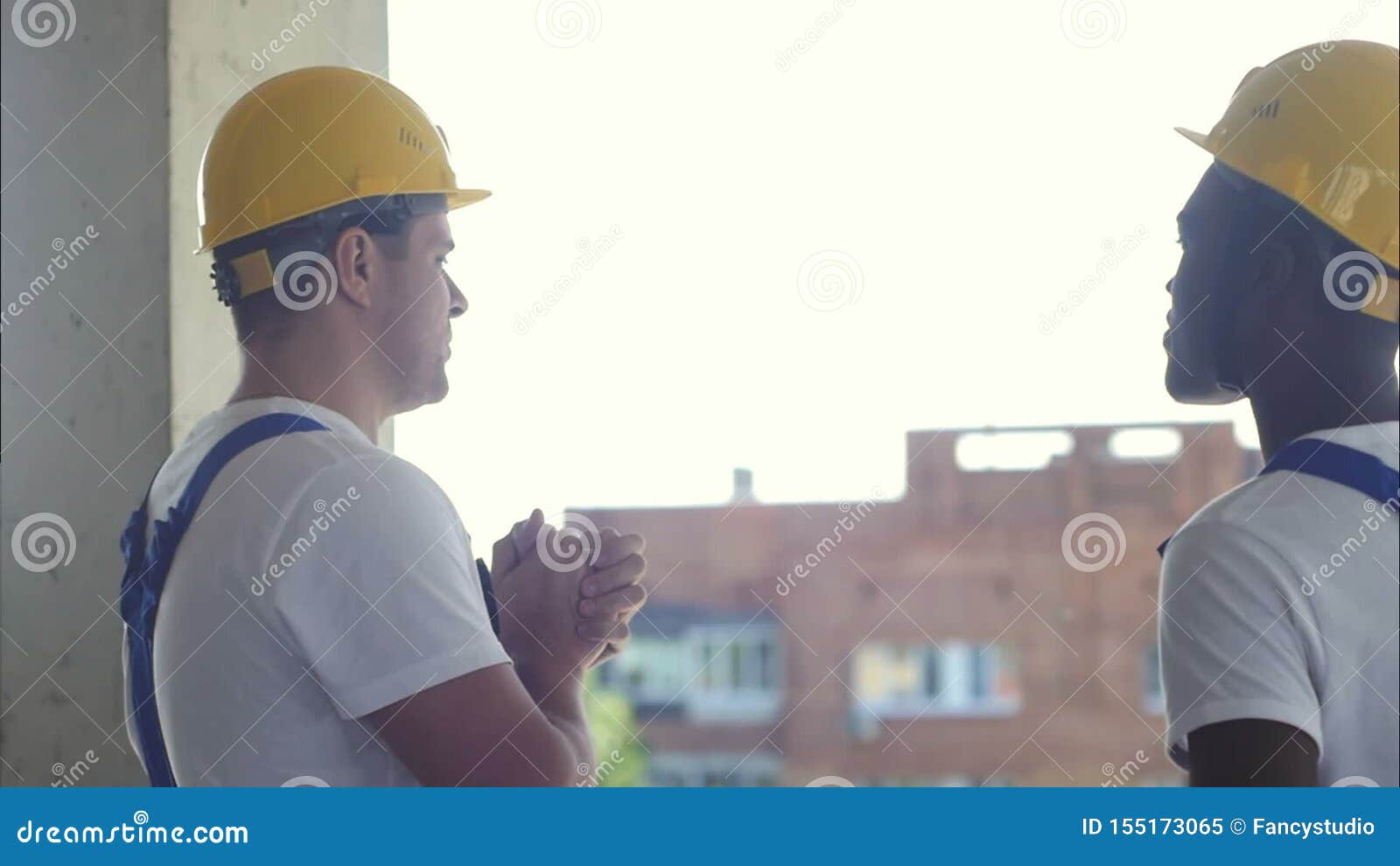 Construction Workers Having a Break while Building a New Home Stock ...