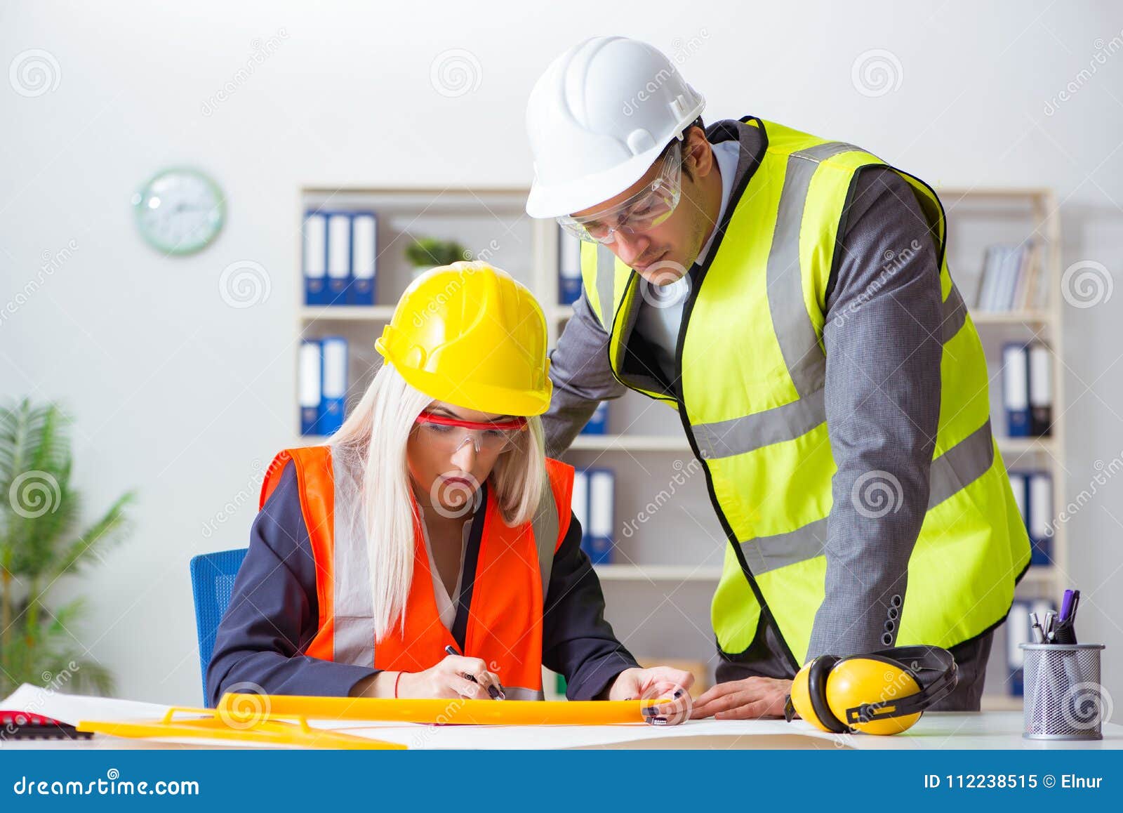 Construction Workers Having Discussion In Office Before Starting Stock ...