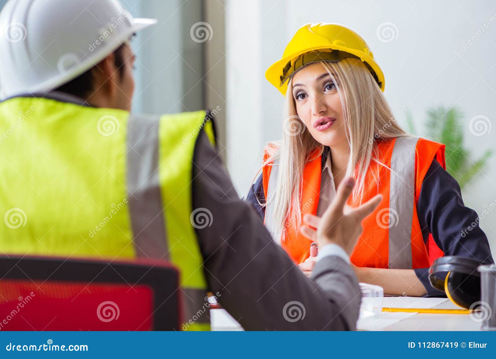 Construction Workers Having Discussion in Office before Starting Stock ...