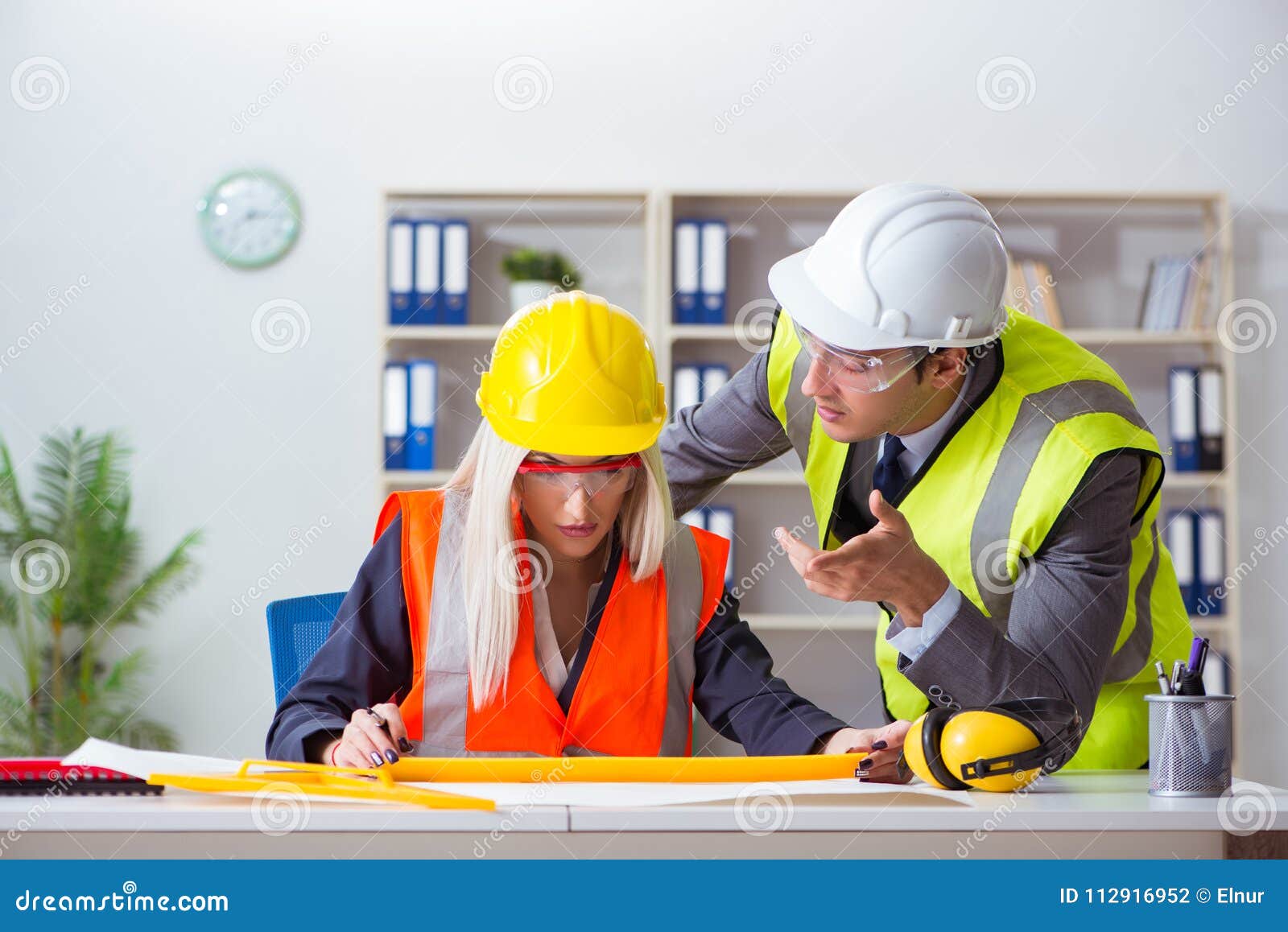 Construction Workers Having Discussion in Office before Starting Stock ...