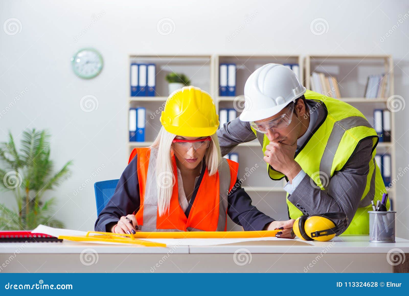 Construction Workers Having Discussion in Office before Starting Stock ...