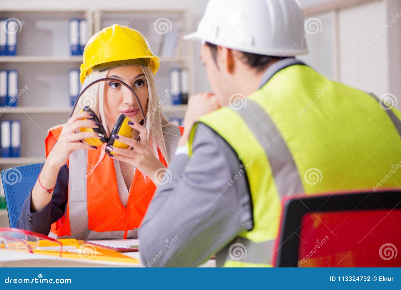 Construction Workers Having Discussion in Office before Starting Stock ...