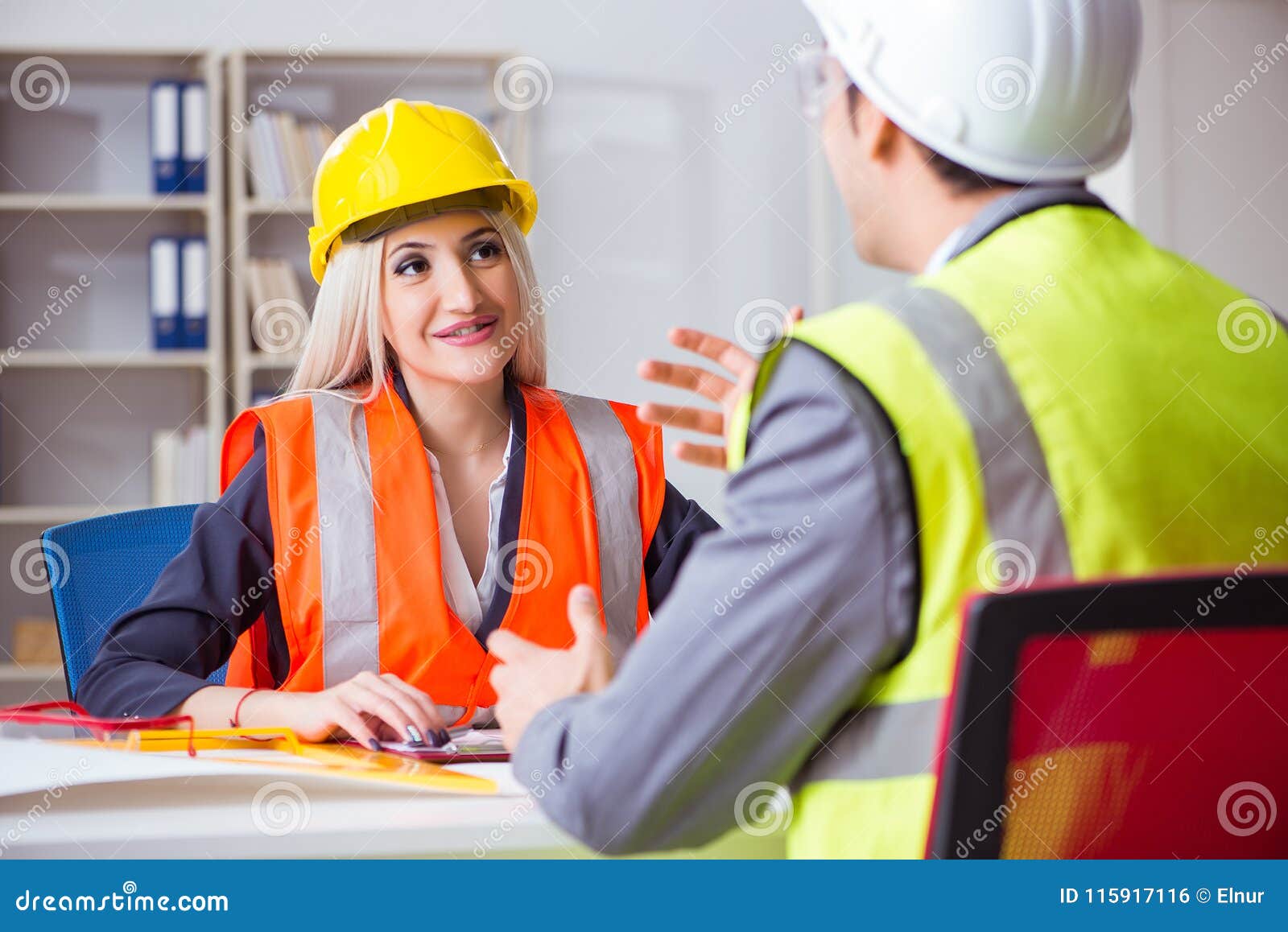 Construction Workers Having Discussion in Office before Starting Stock ...