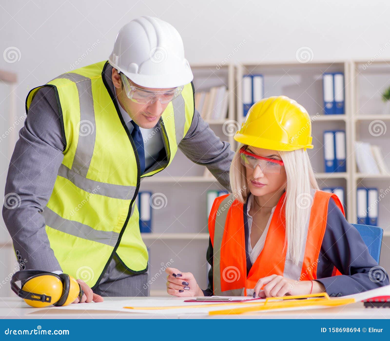 Construction Workers Having Discussion in Office before Starting Stock ...