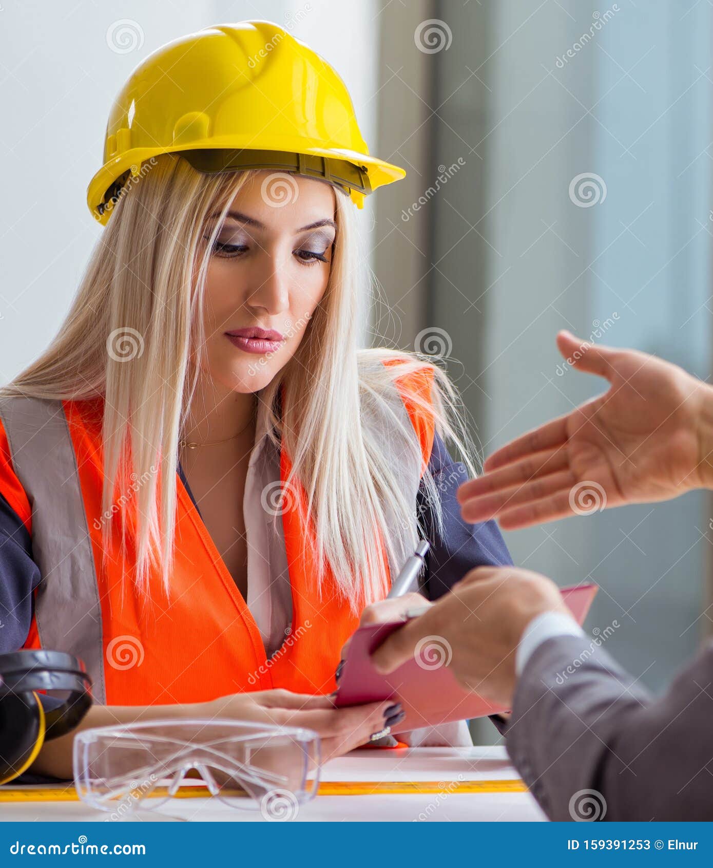 Construction Workers Having Discussion in Office before Starting Stock ...