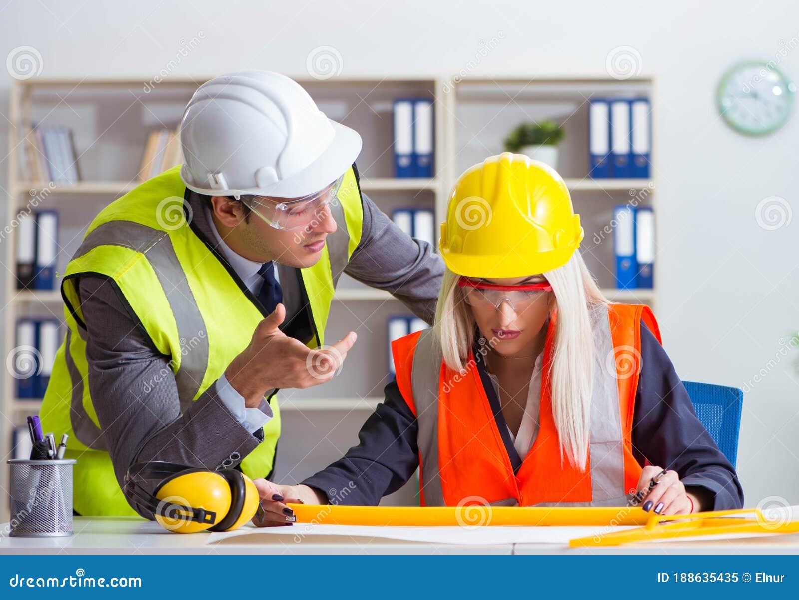 Construction Workers Having Discussion in Office before Starting Stock ...