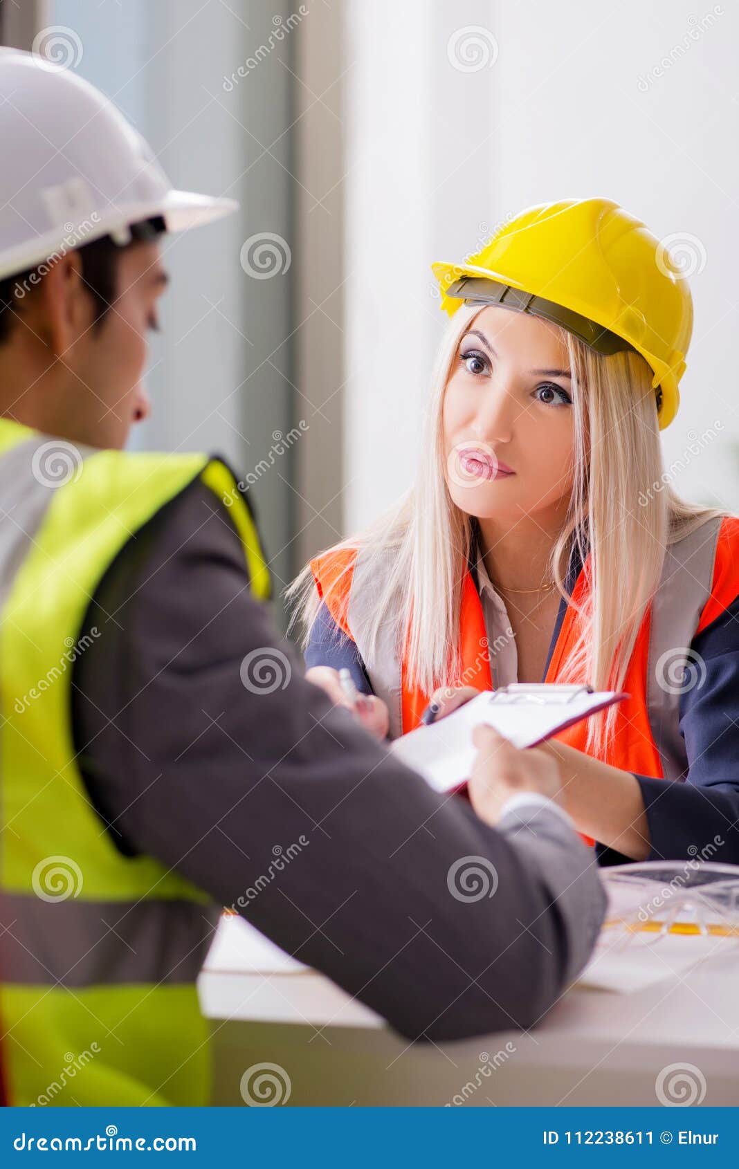 Construction Workers Having Discussion in Office before Starting Stock ...