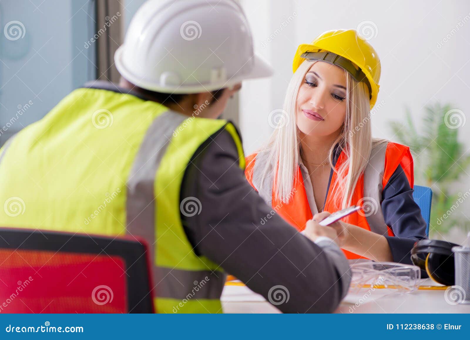 Construction Workers Having Discussion in Office before Starting Stock ...
