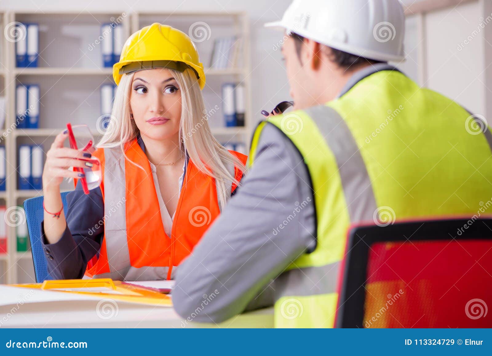 Construction Workers Having Discussion in Office before Starting Stock ...