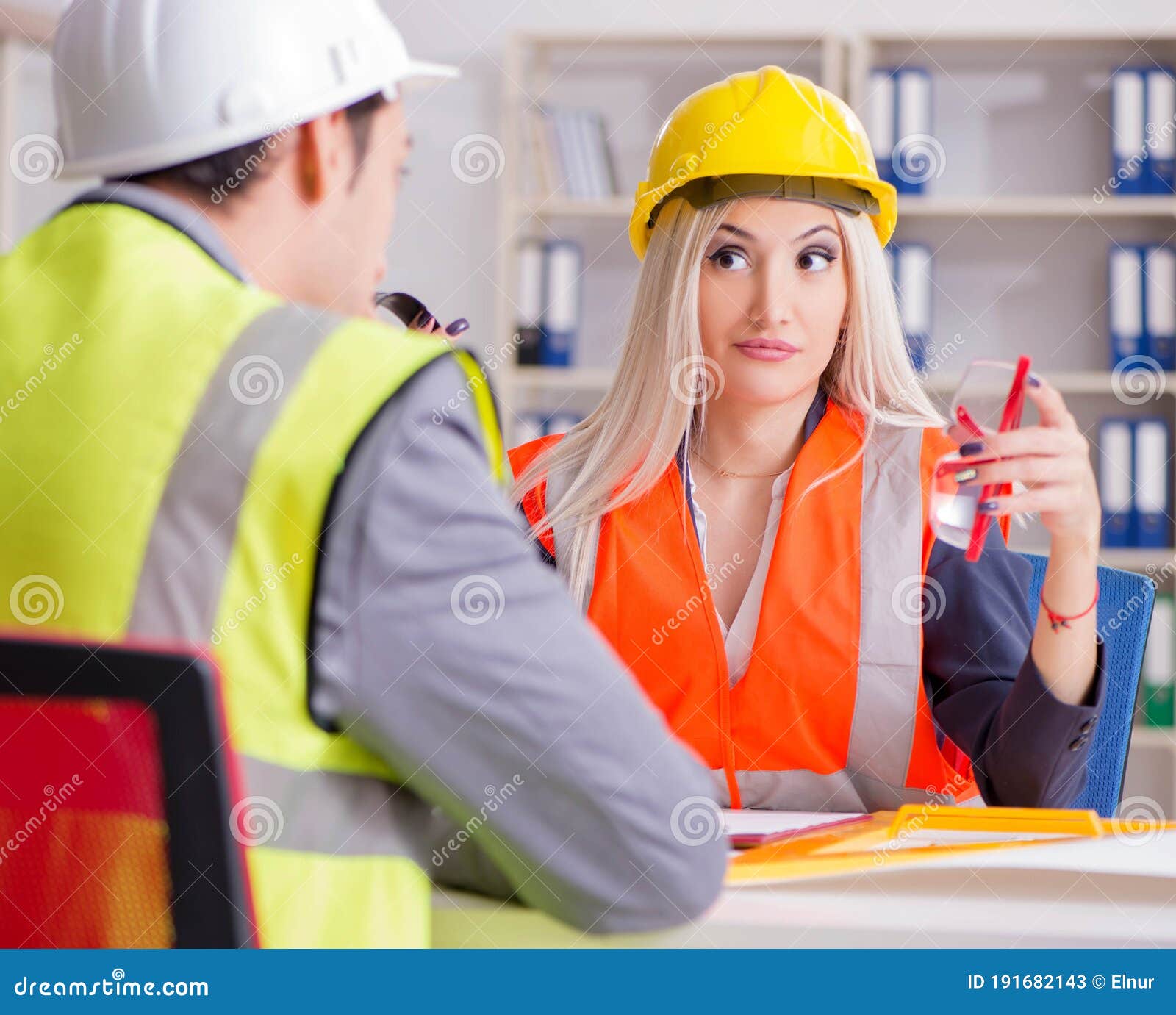 Construction Workers Having Discussion in Office before Starting Stock ...
