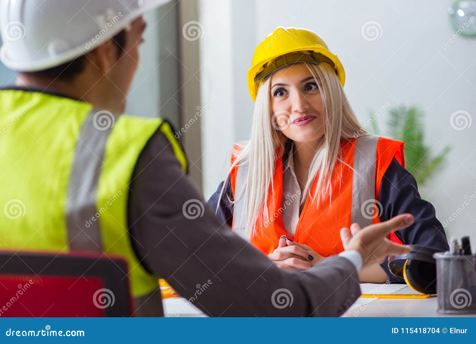 Construction Workers Having Discussion in Office before Starting Stock ...