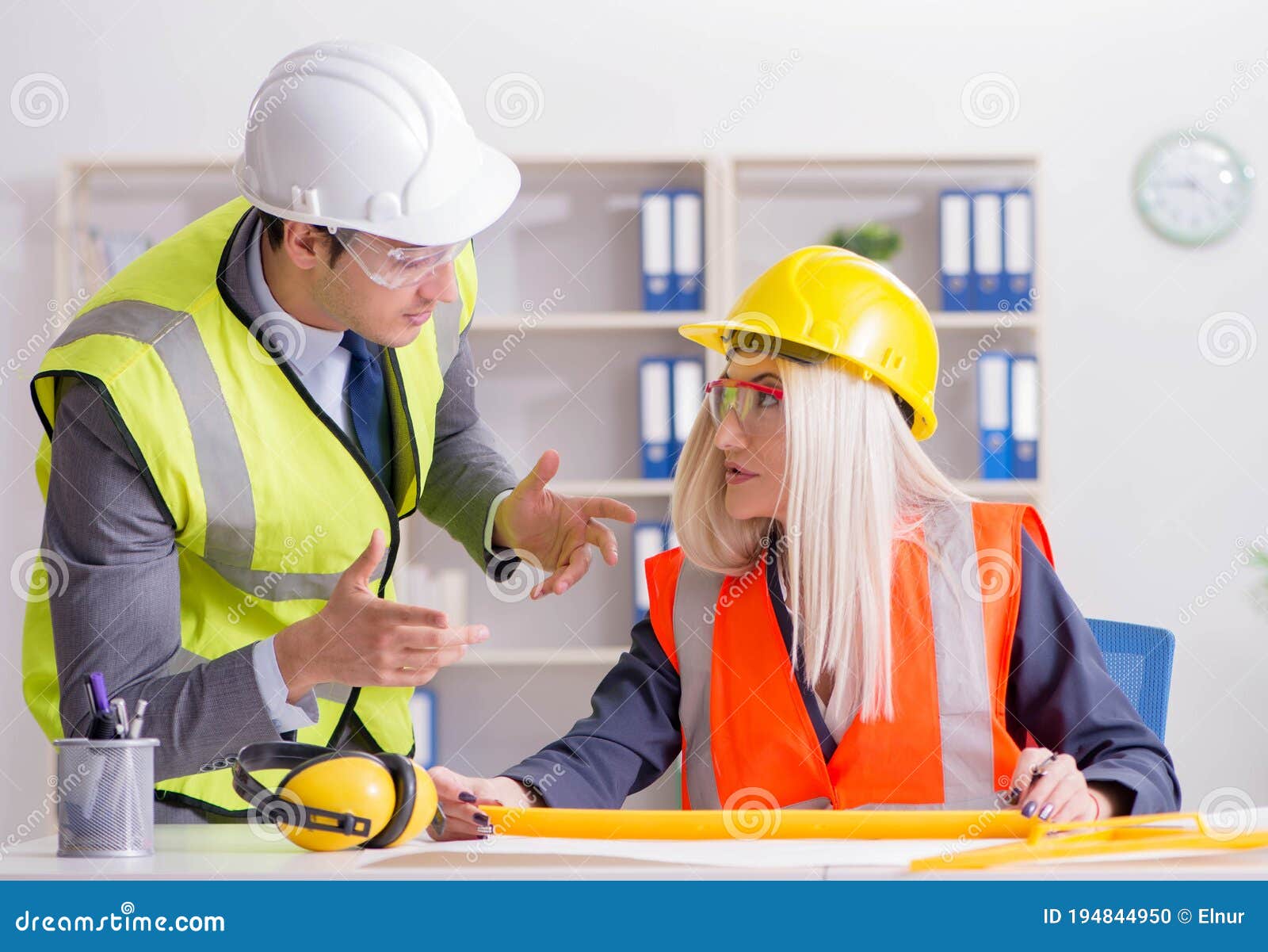 Construction Workers Having Discussion in Office before Starting Stock ...
