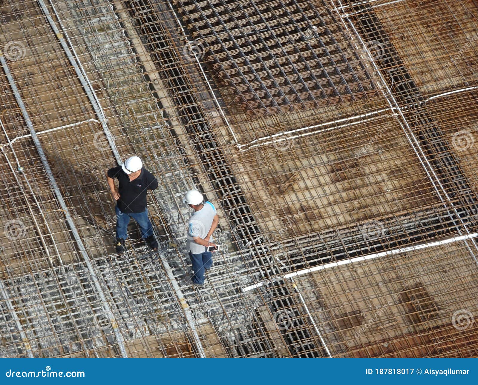 Construction Workers Having a Discussion at the Construction Site ...