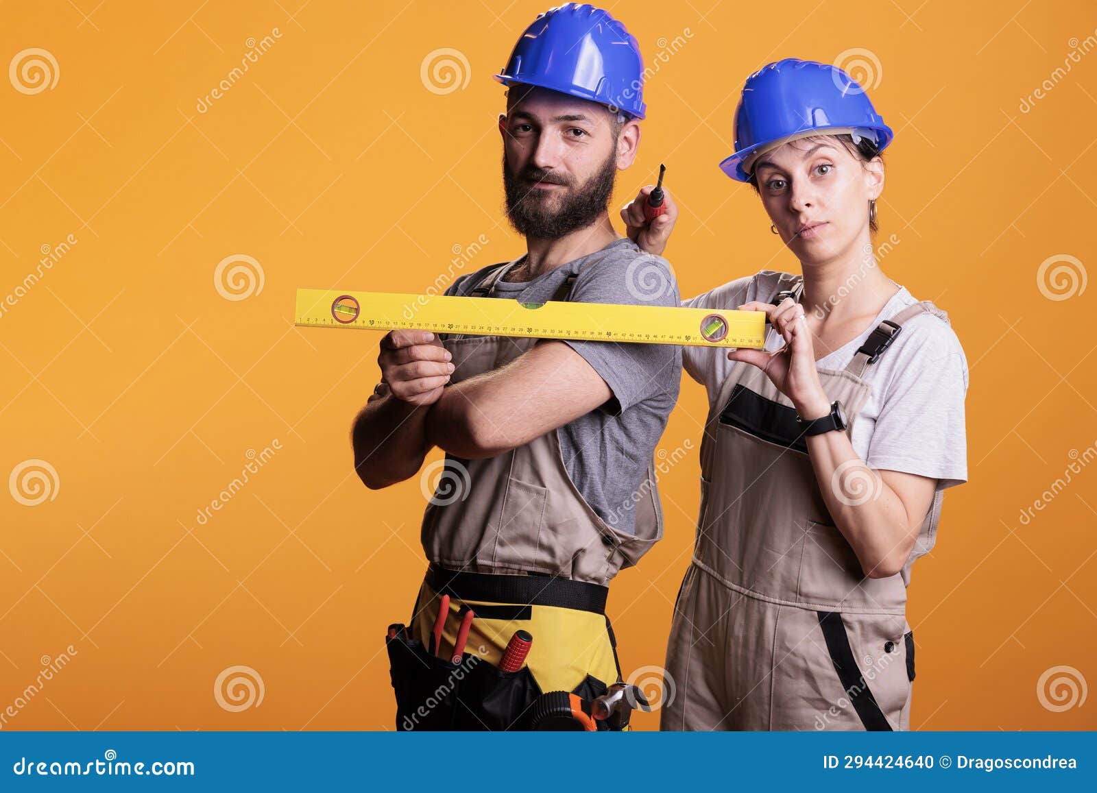 Construction Workers Holding Screwdriver and Water Level Stock Photo ...