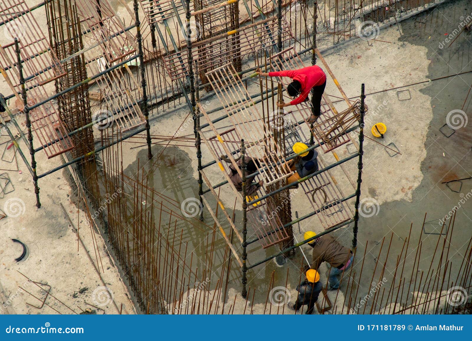 Construction Workers in India Climbing and Building Rebar Platform at ...