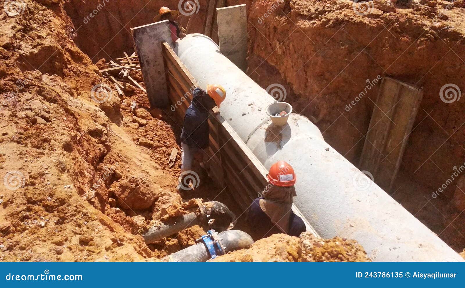 Construction Workers Install Concrete Pipe Culvert in the Underground ...