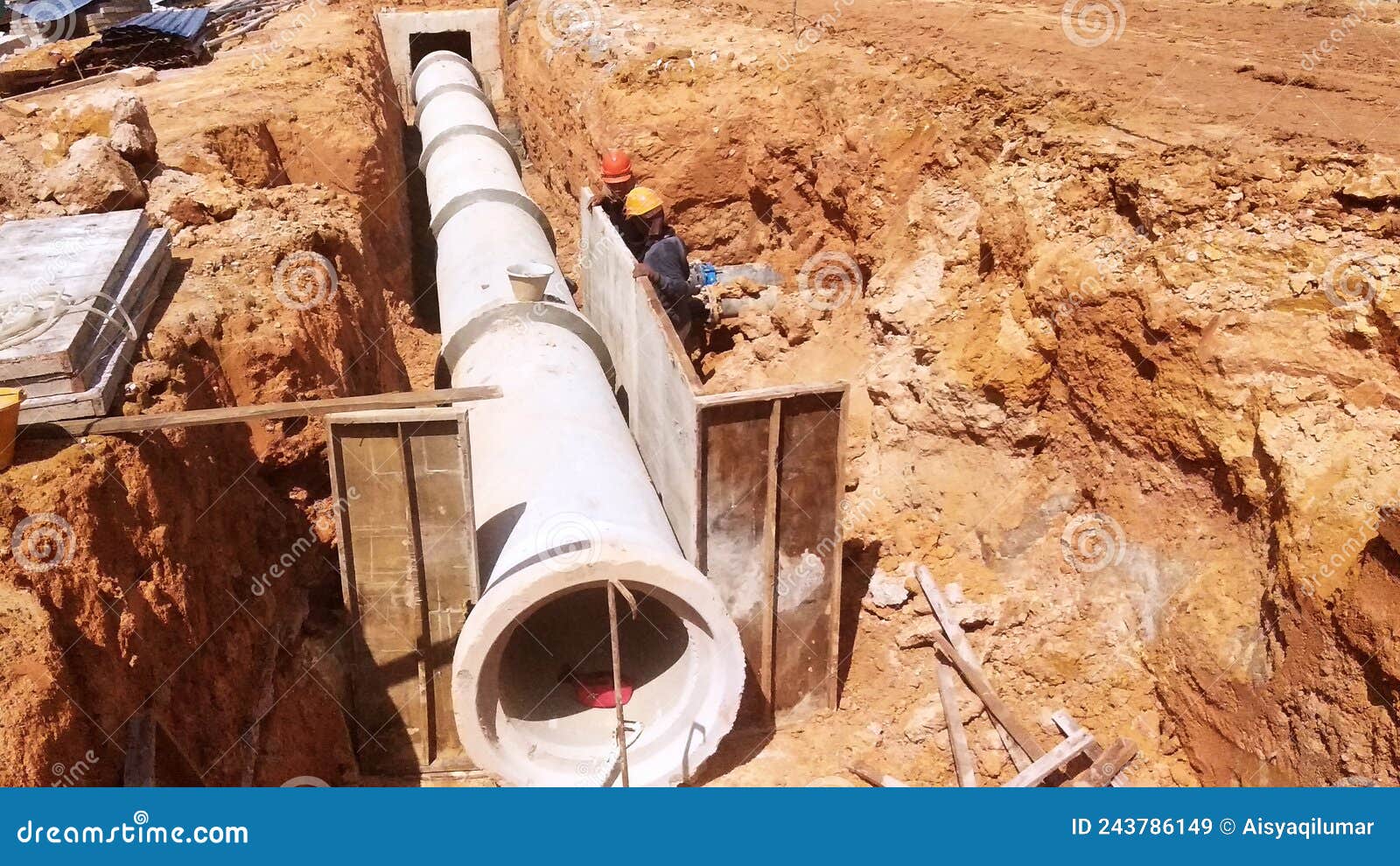 Construction Workers Install Concrete Pipe Culvert in the Underground ...