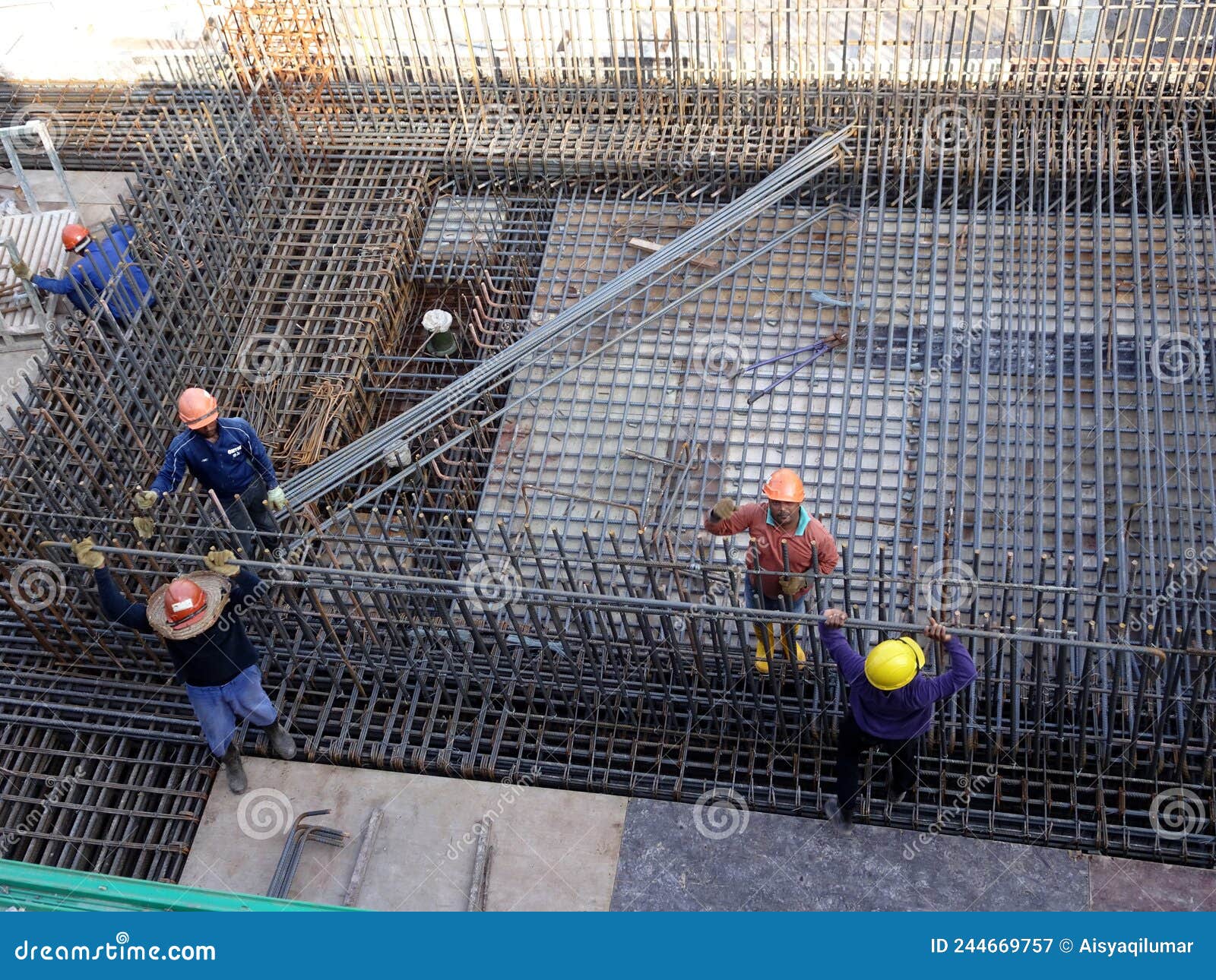 Construction Workers Install Reinforcement Bars at the Construction ...