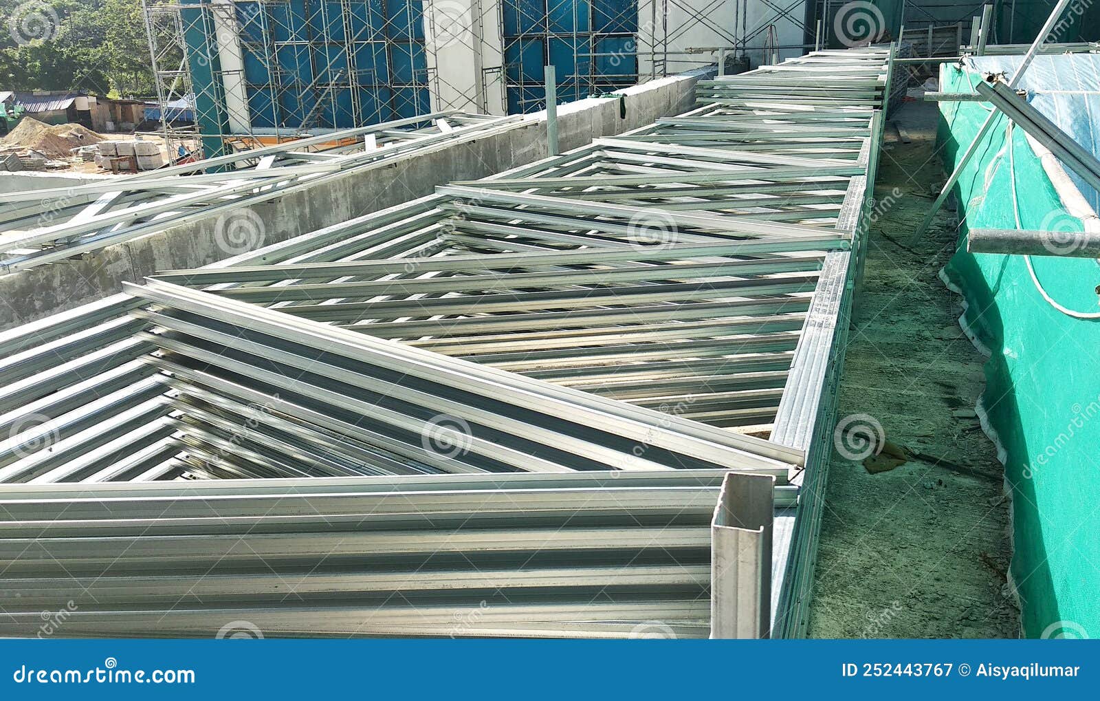 Construction Workers Install Trusses and Roofing Sheets at Construction ...