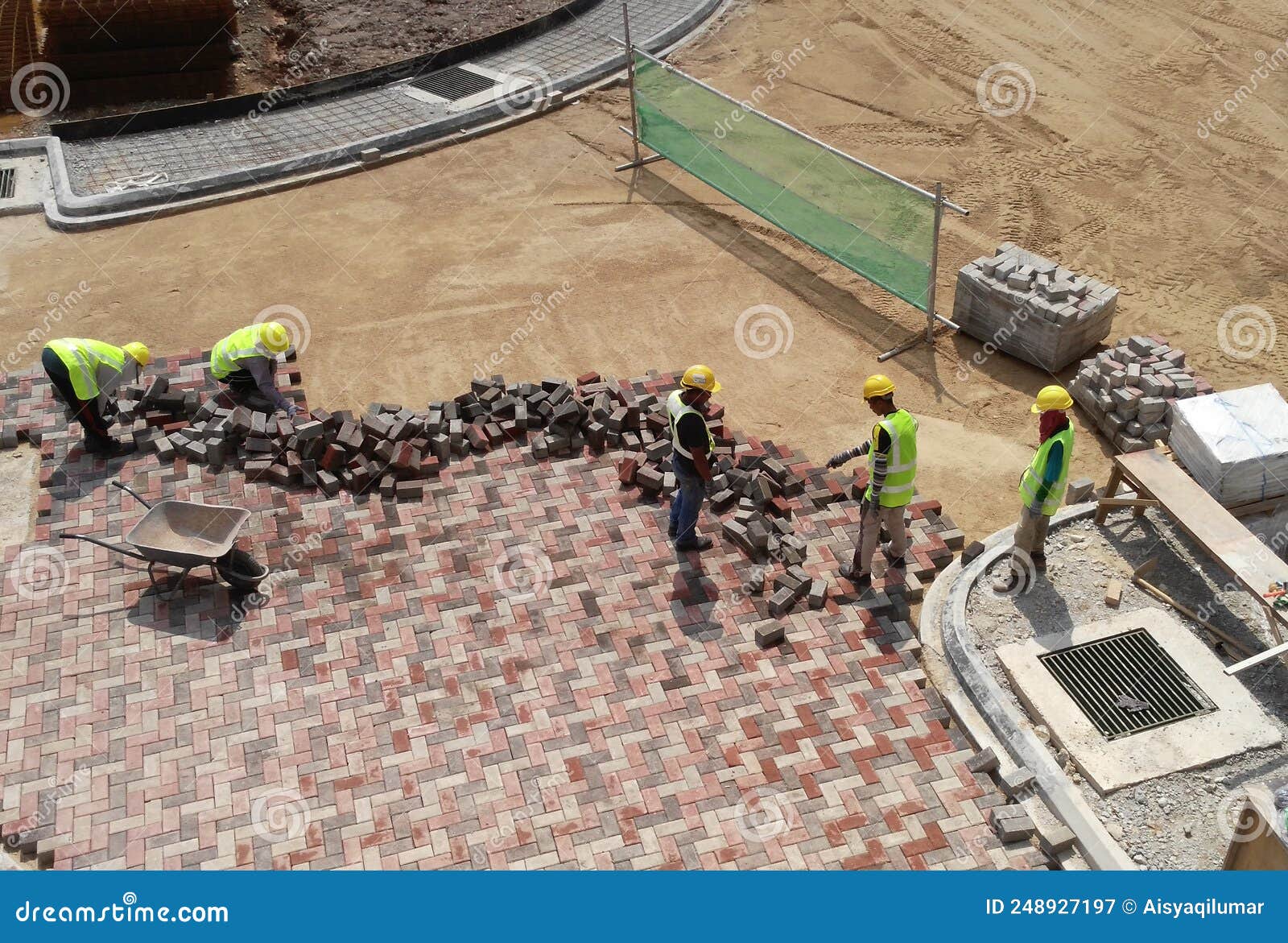 Construction Workers Installing and Arrange Precast Concrete Pavers ...