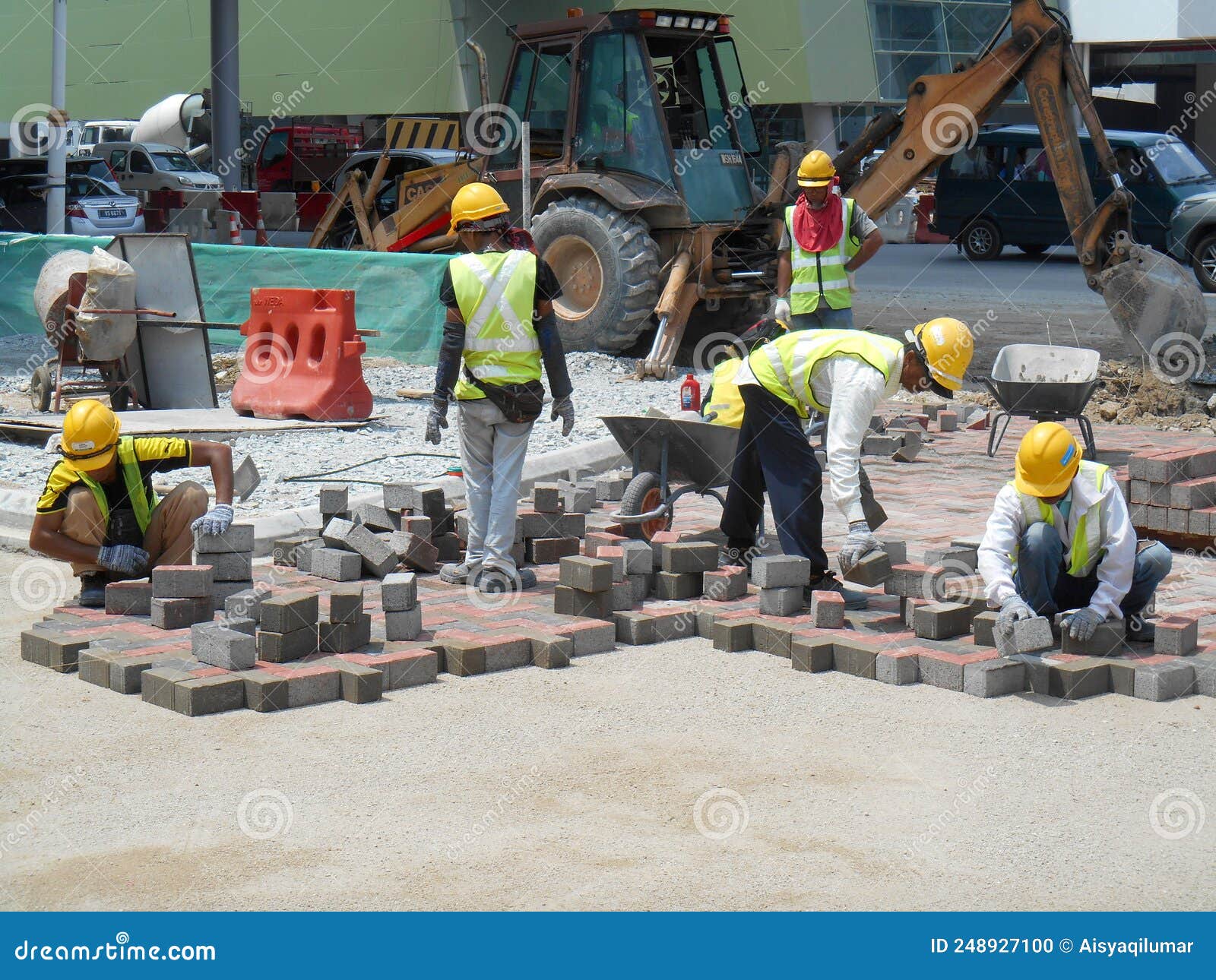 Construction Workers Installing and Arranging Precast Concrete Pavers ...