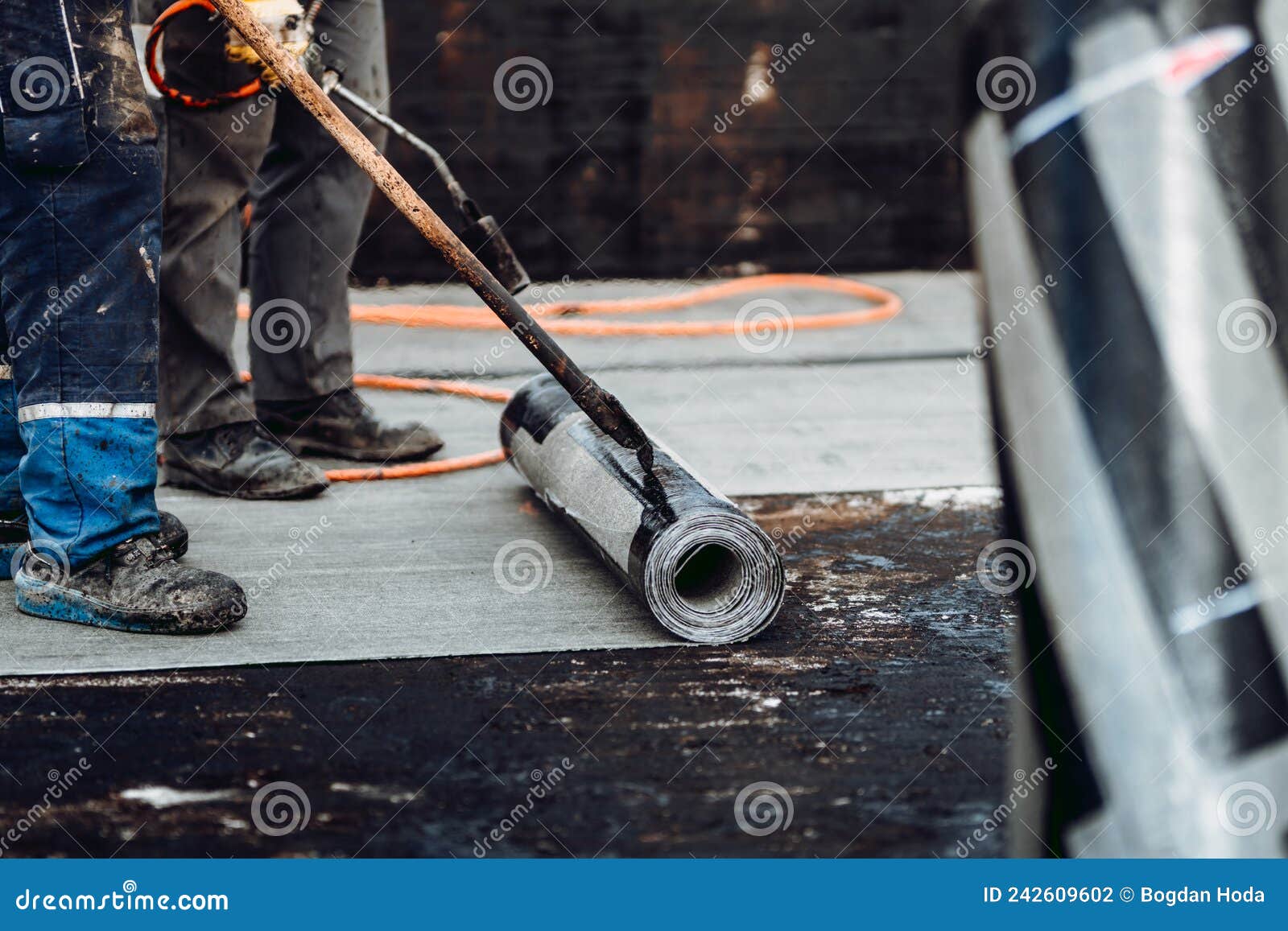 Construction Workers Installing Bituminous Membrane Waterproofing ...