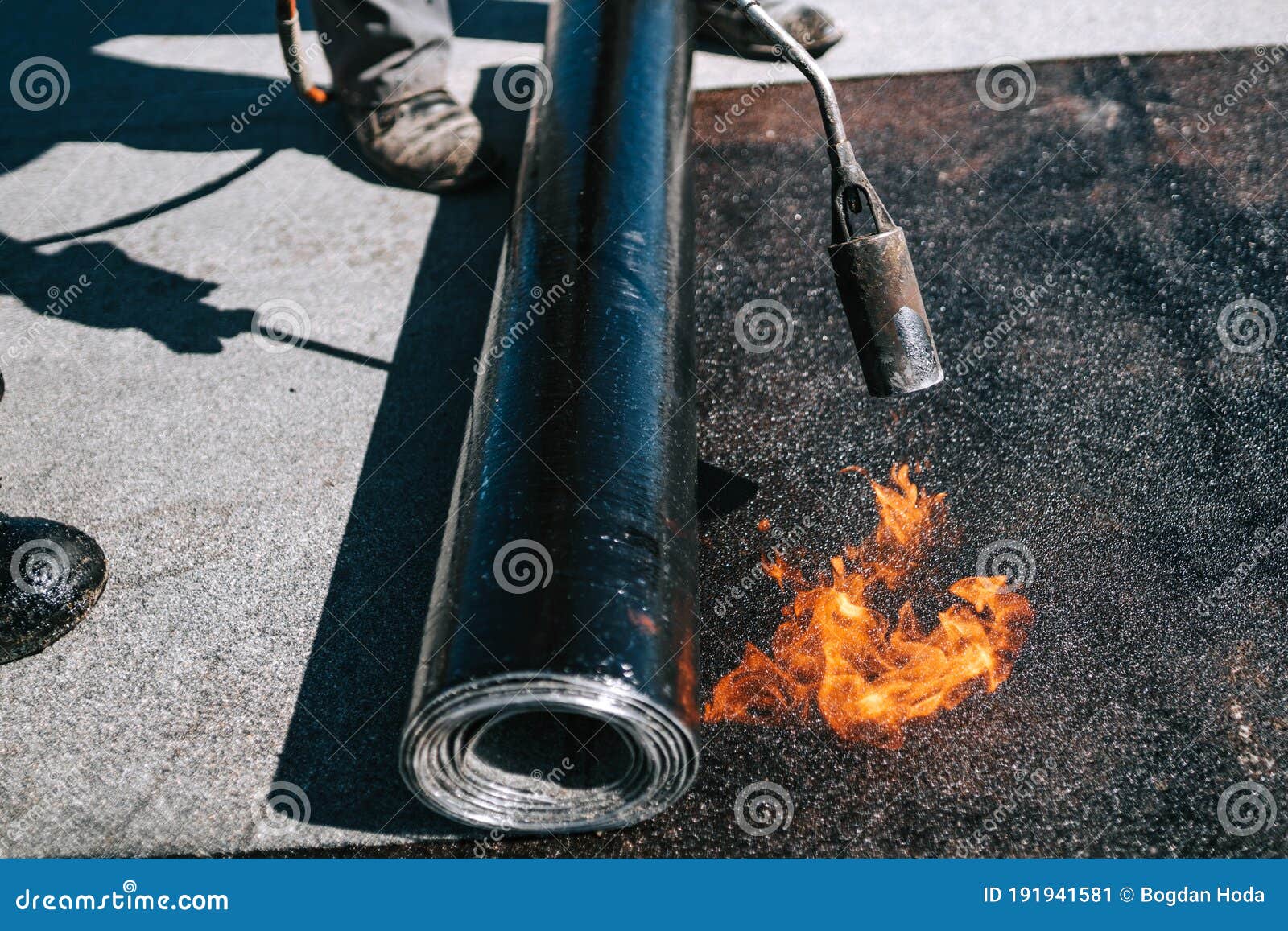 Construction Workers Installing Bituminous Membrane Waterproofing ...