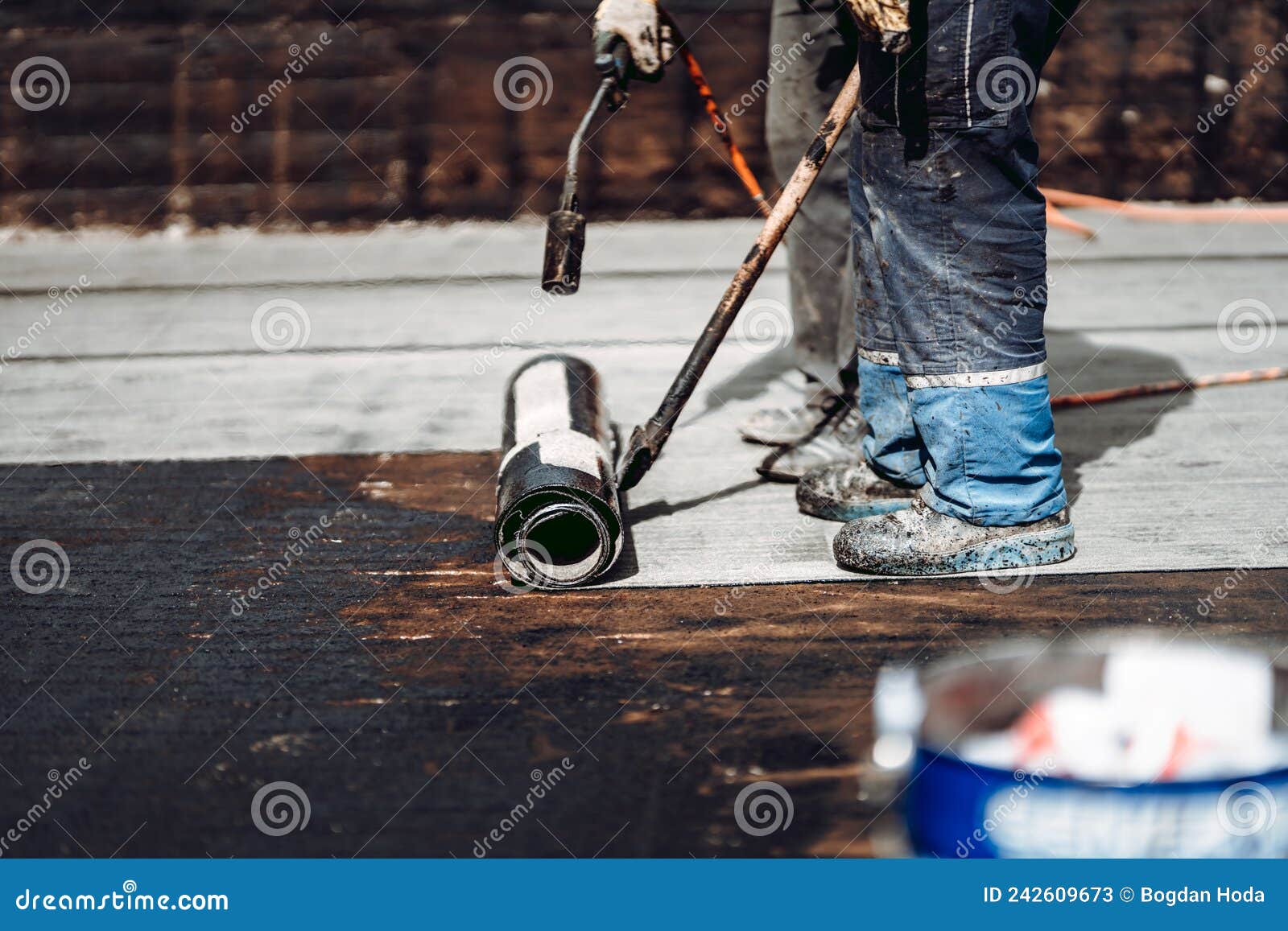 Construction Workers Installing Bituminous Membrane Waterproofing ...