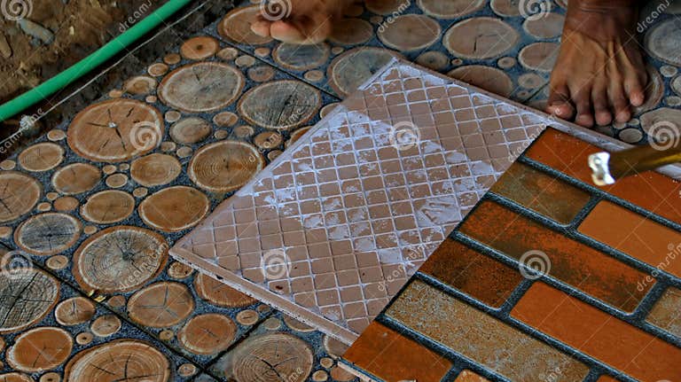 Construction Workers when Installing Ceramic Tiles for Floors Stock ...