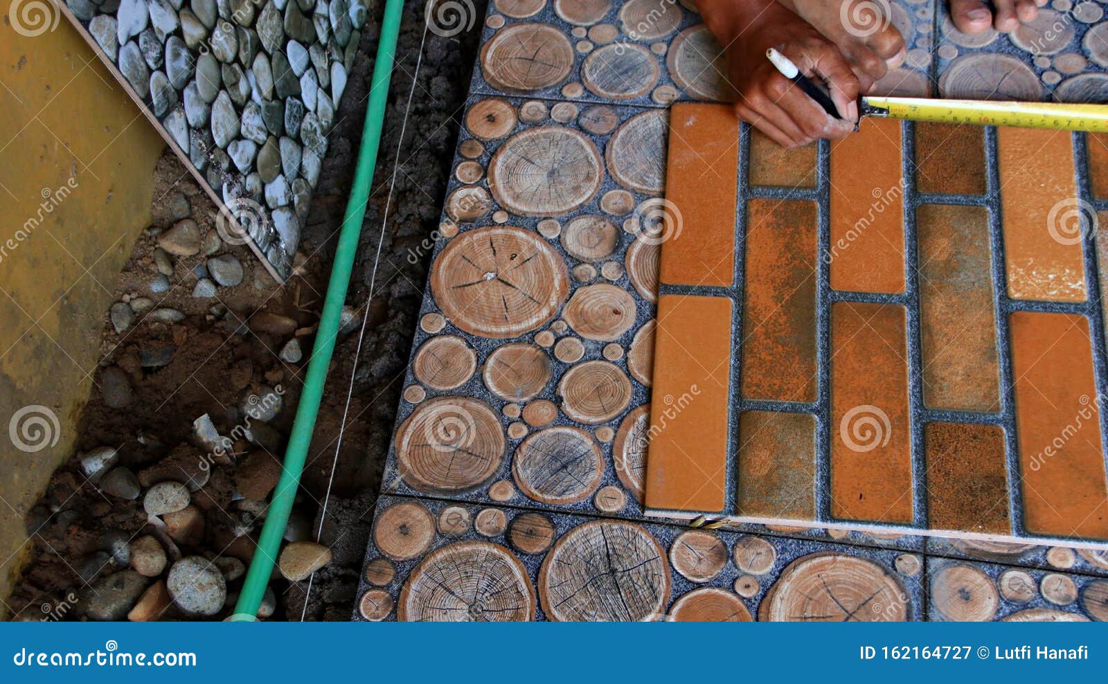 Construction Workers when Installing Ceramic Tiles for Floors Stock ...