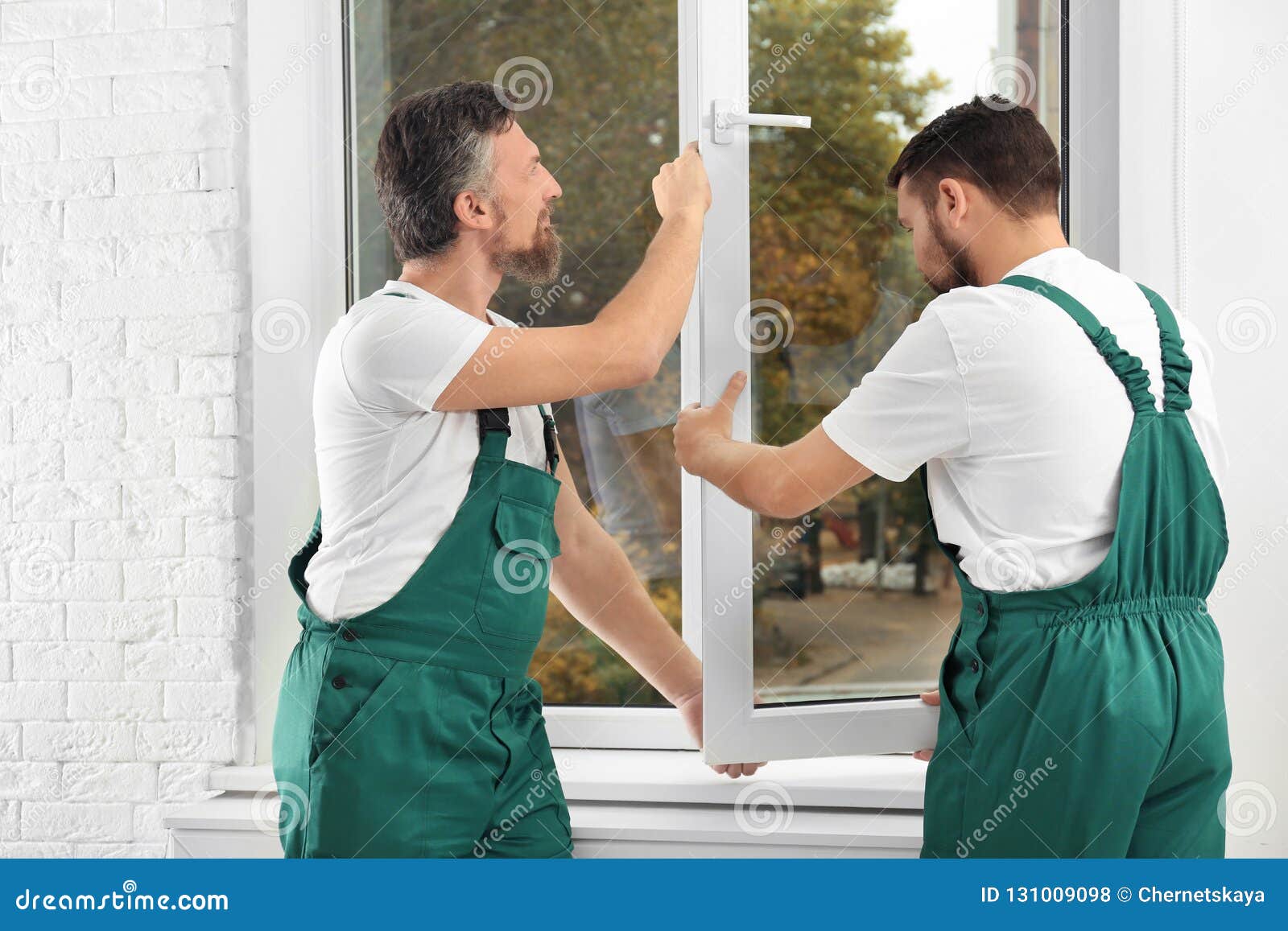 Construction Workers Installing New Window Stock Photo - Image of ...
