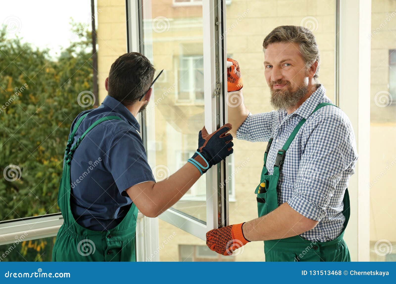 Construction Workers Installing New Window Stock Photo - Image of ...