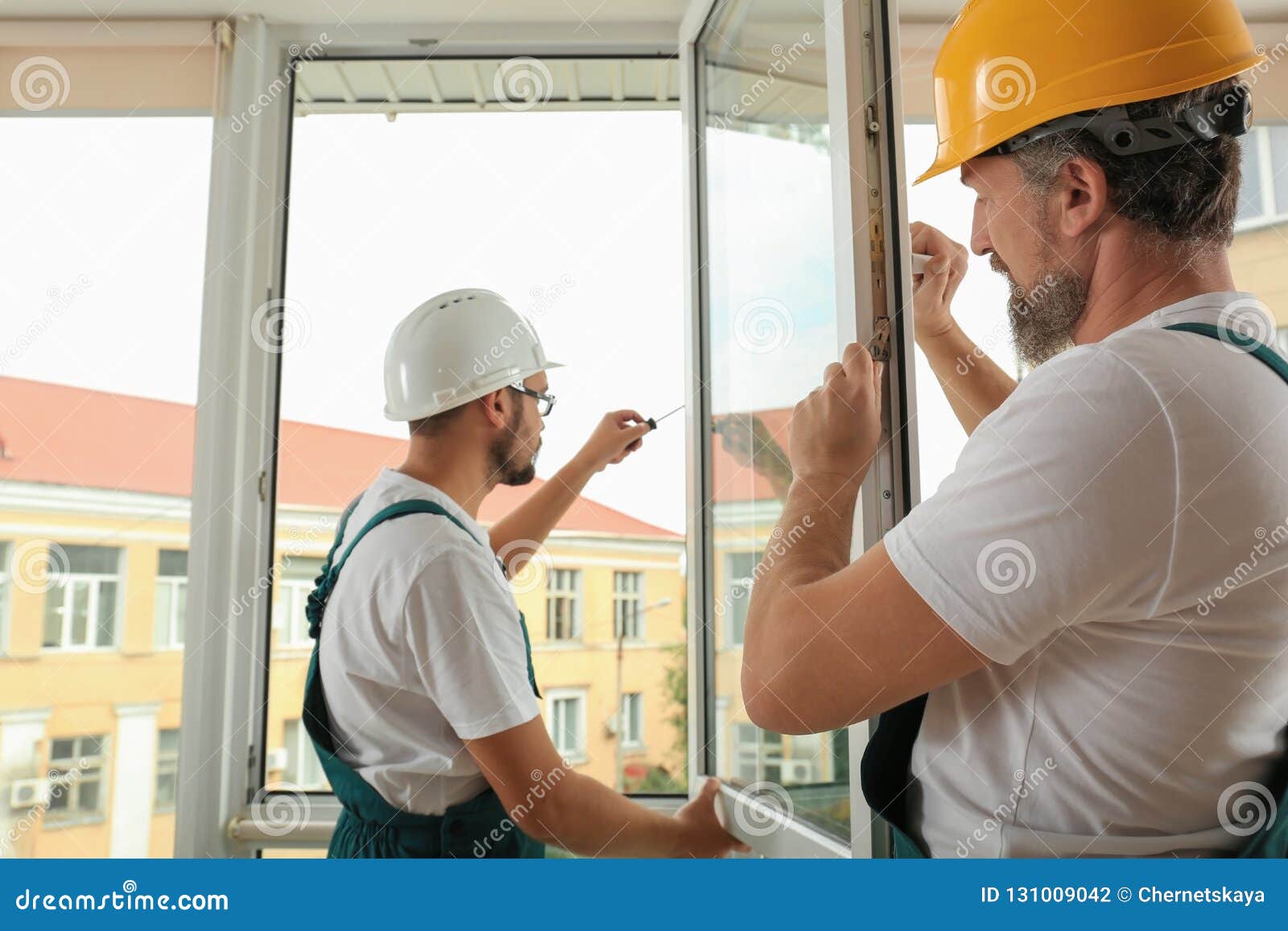 Construction Workers Installing New Window Stock Photo - Image of build ...