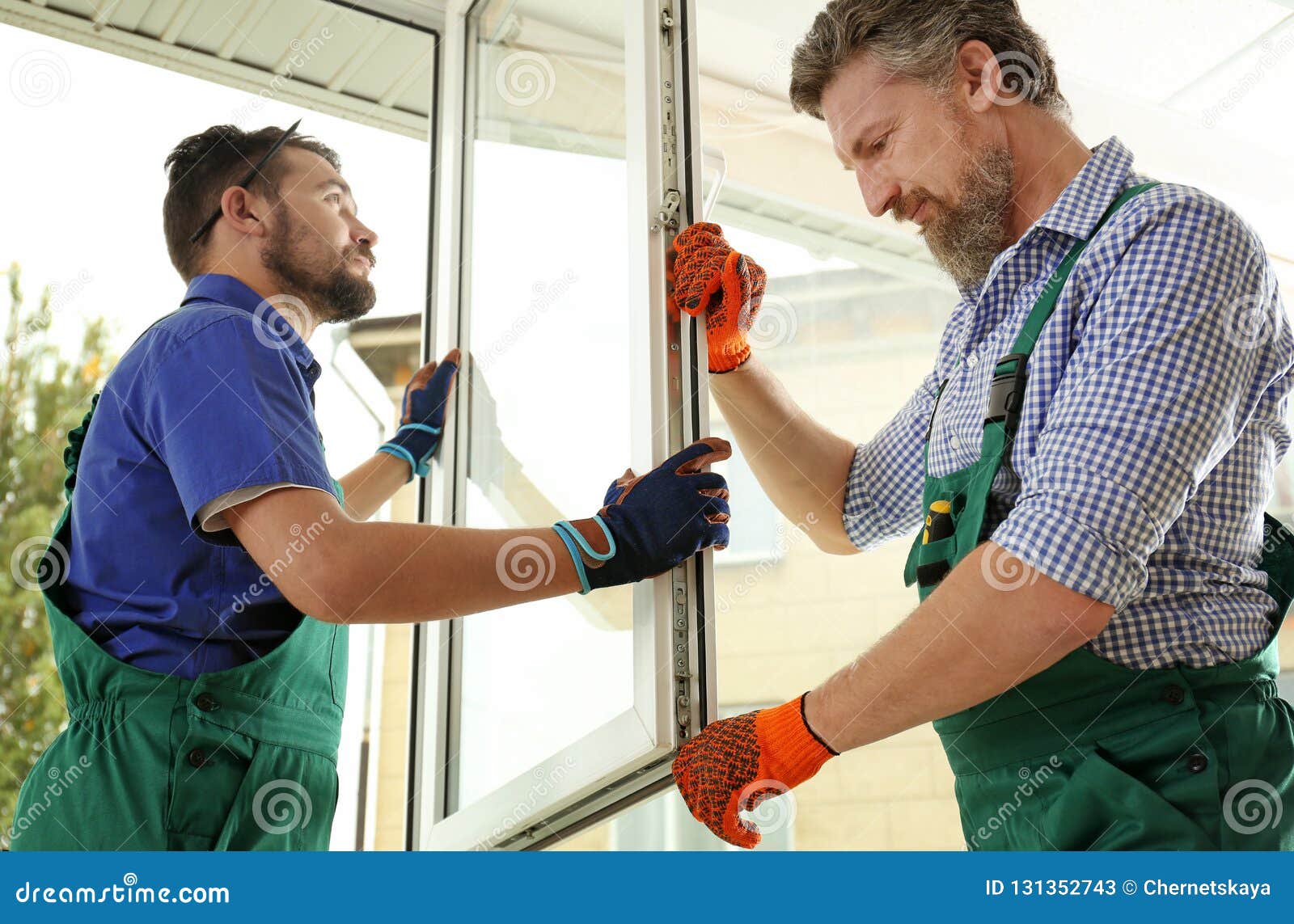 Construction Workers Installing New Window Stock Image - Image of build ...