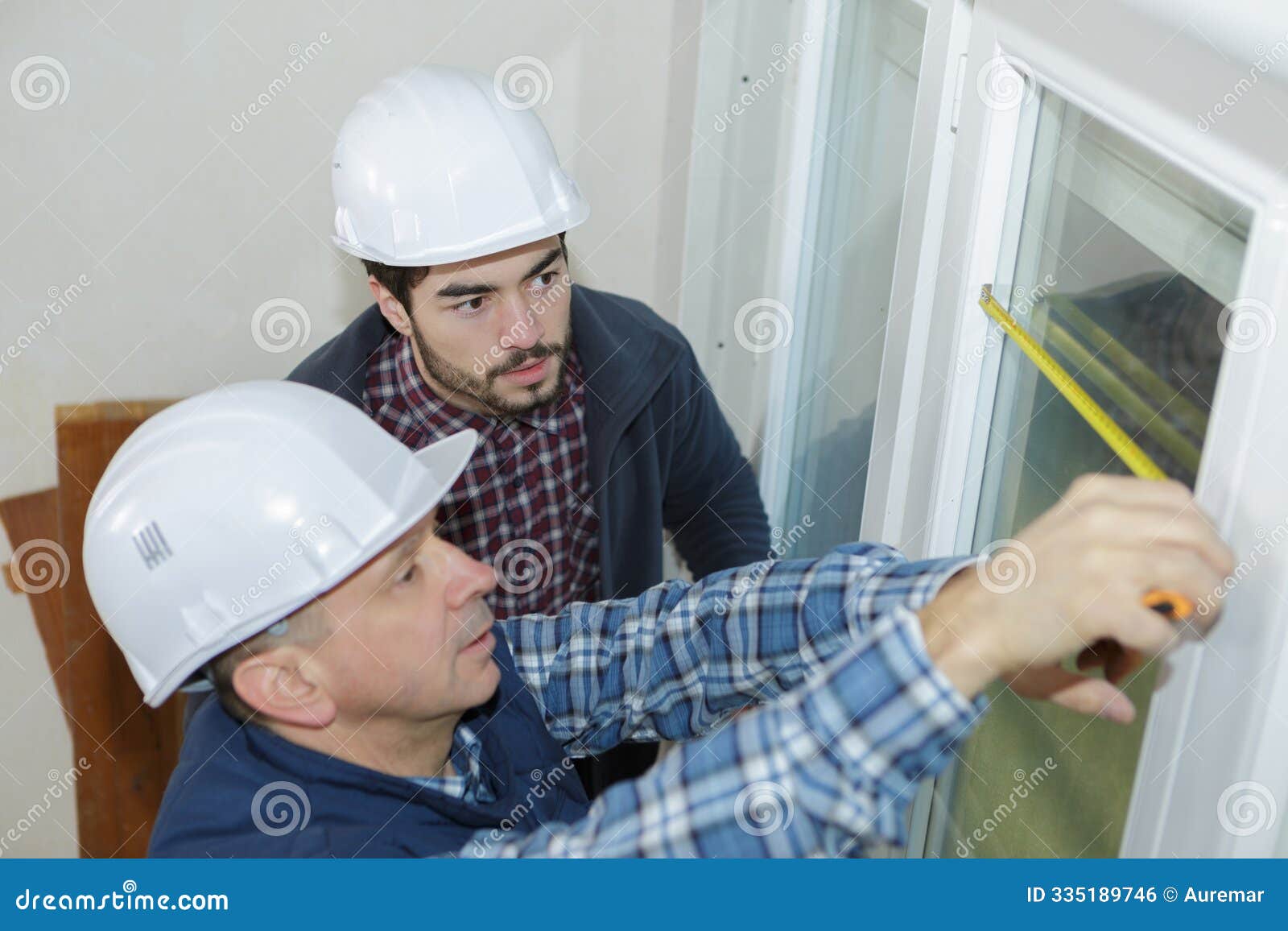 Construction Workers Installing New Windows in House Stock Photo ...