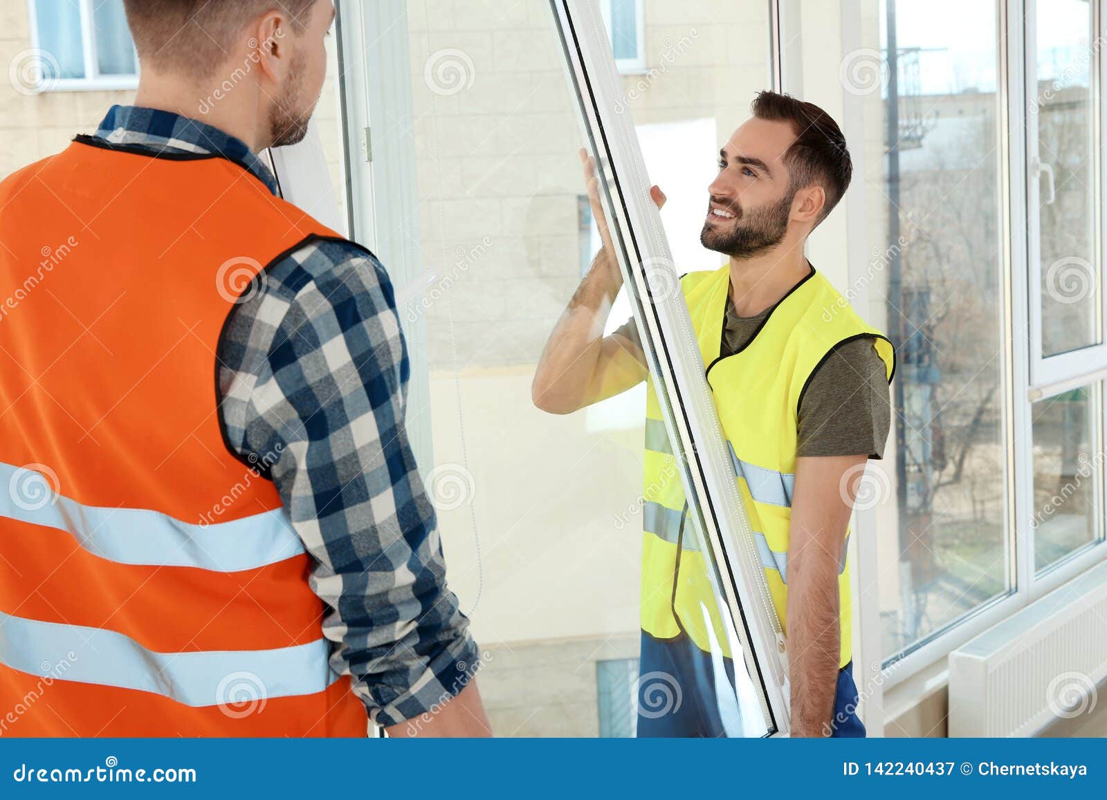 Construction Workers Installing Plastic Window Stock Image - Image of ...