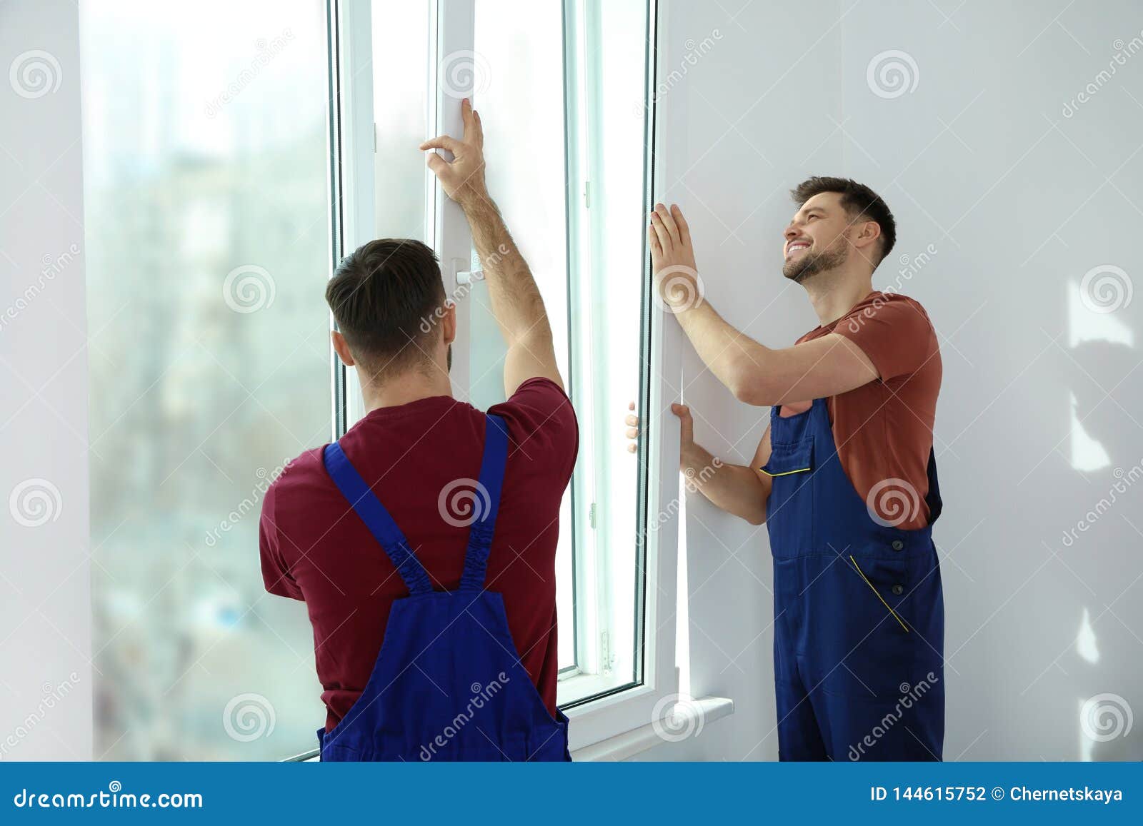 Construction Workers Installing Plastic Window Stock Photo - Image of ...