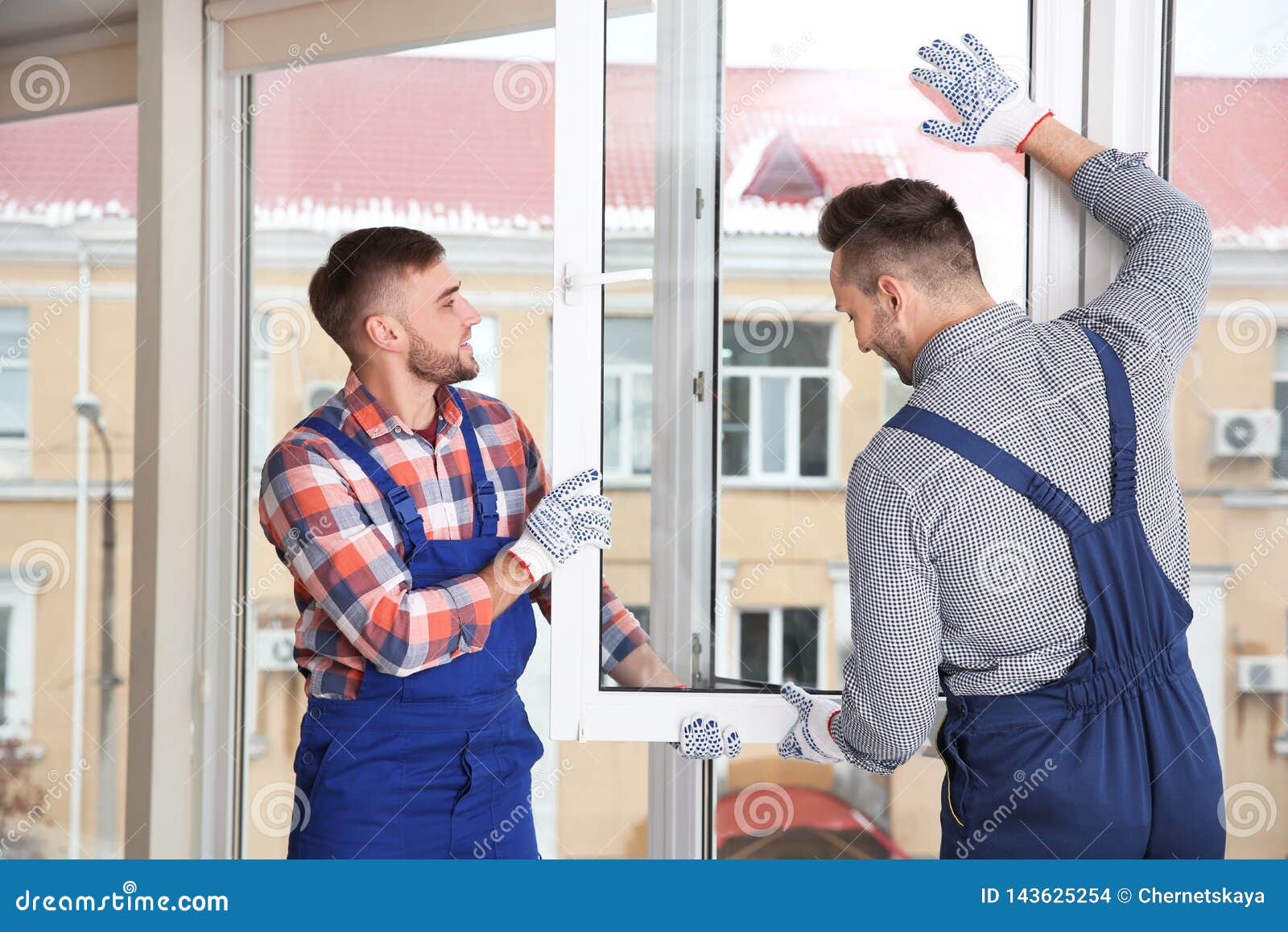 Construction Workers Installing Plastic Window Stock Photo - Image of ...